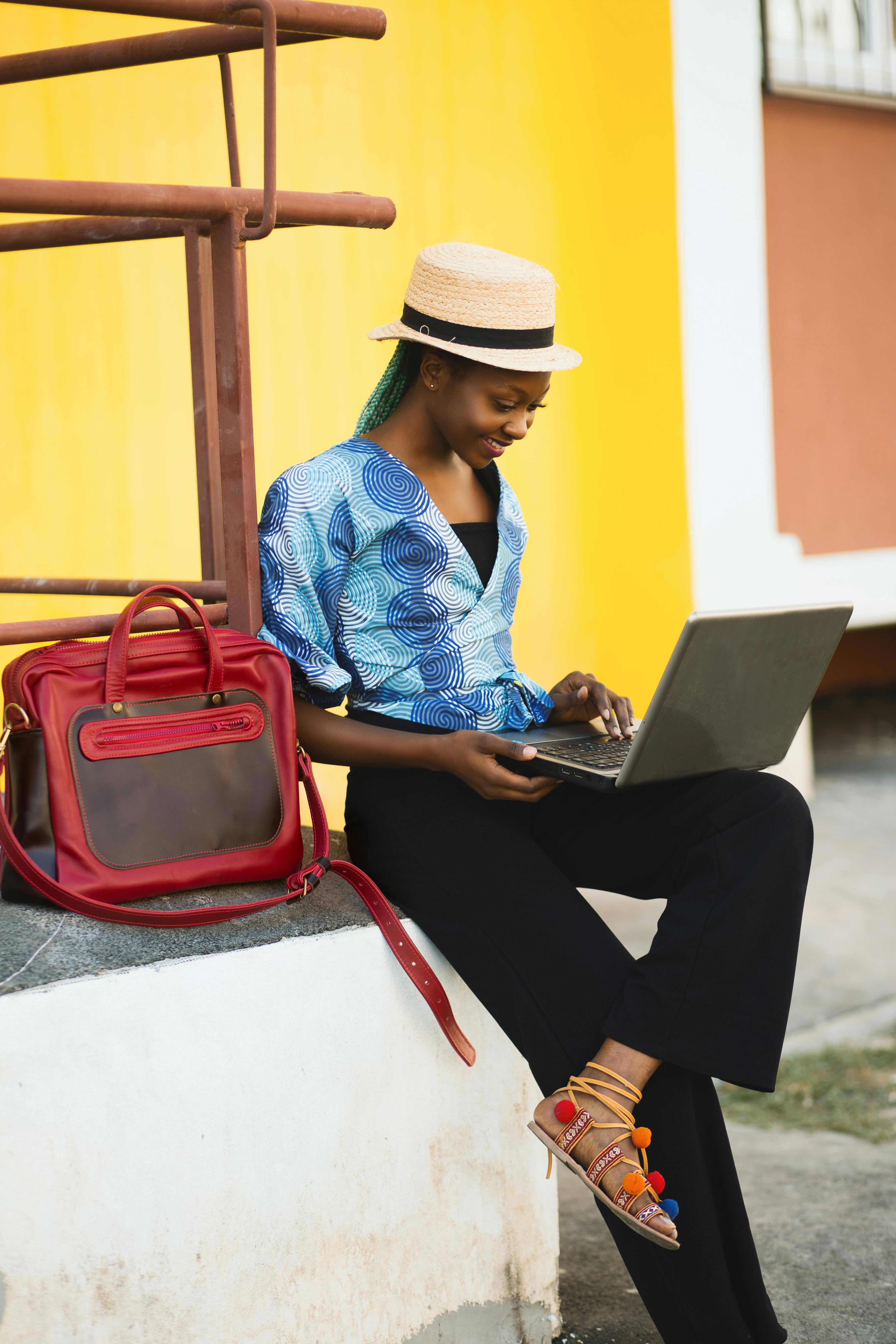 Woman Sitting While Using Laptop Computer · Free Stock Photo