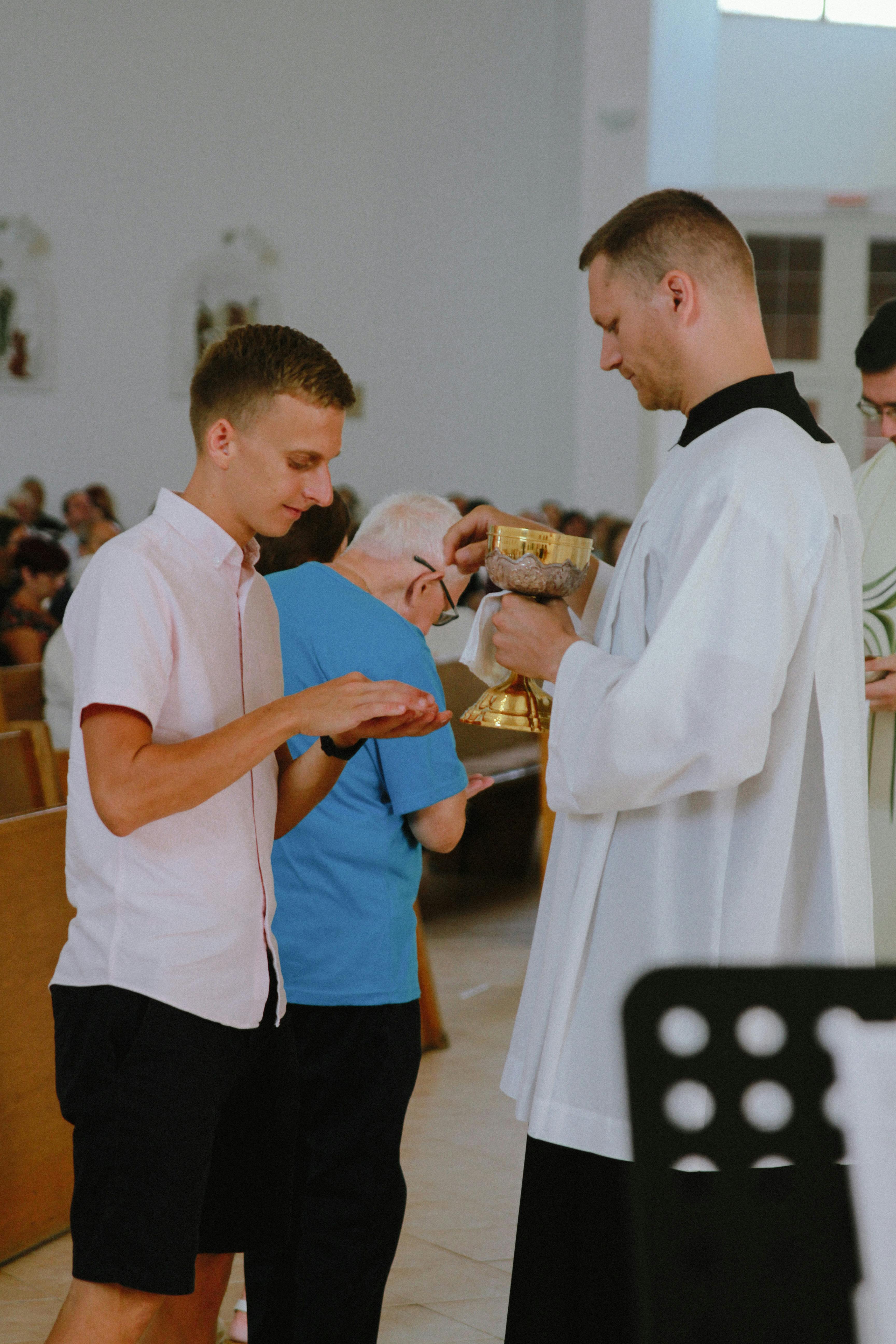 A Man Receiving the Holy Communion · Free Stock Photo