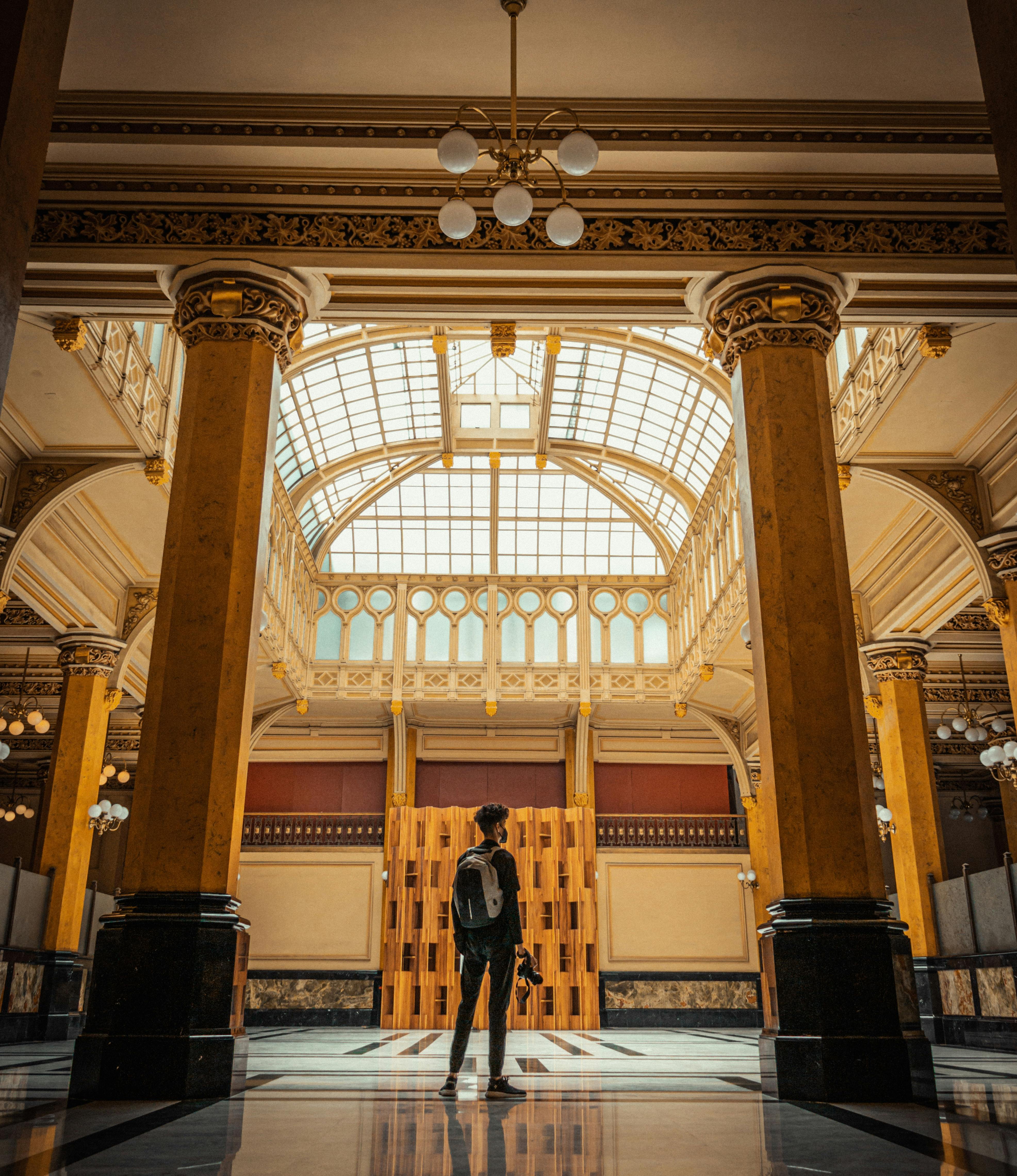 Photographer Capturing Inside Ruins · Free Stock Photo