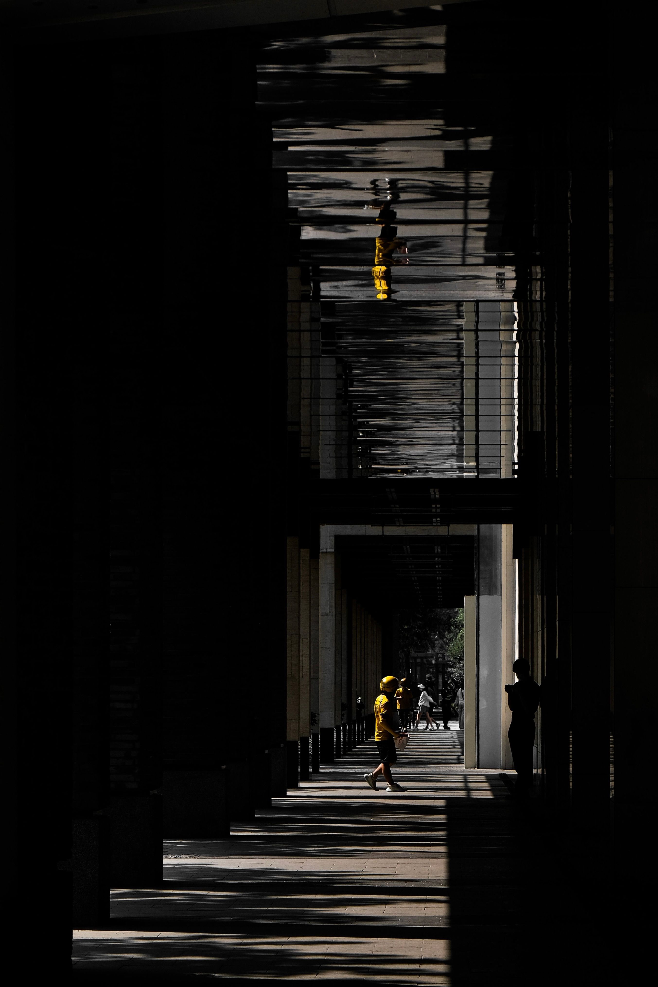 People in a Hallway of a Building · Free Stock Photo