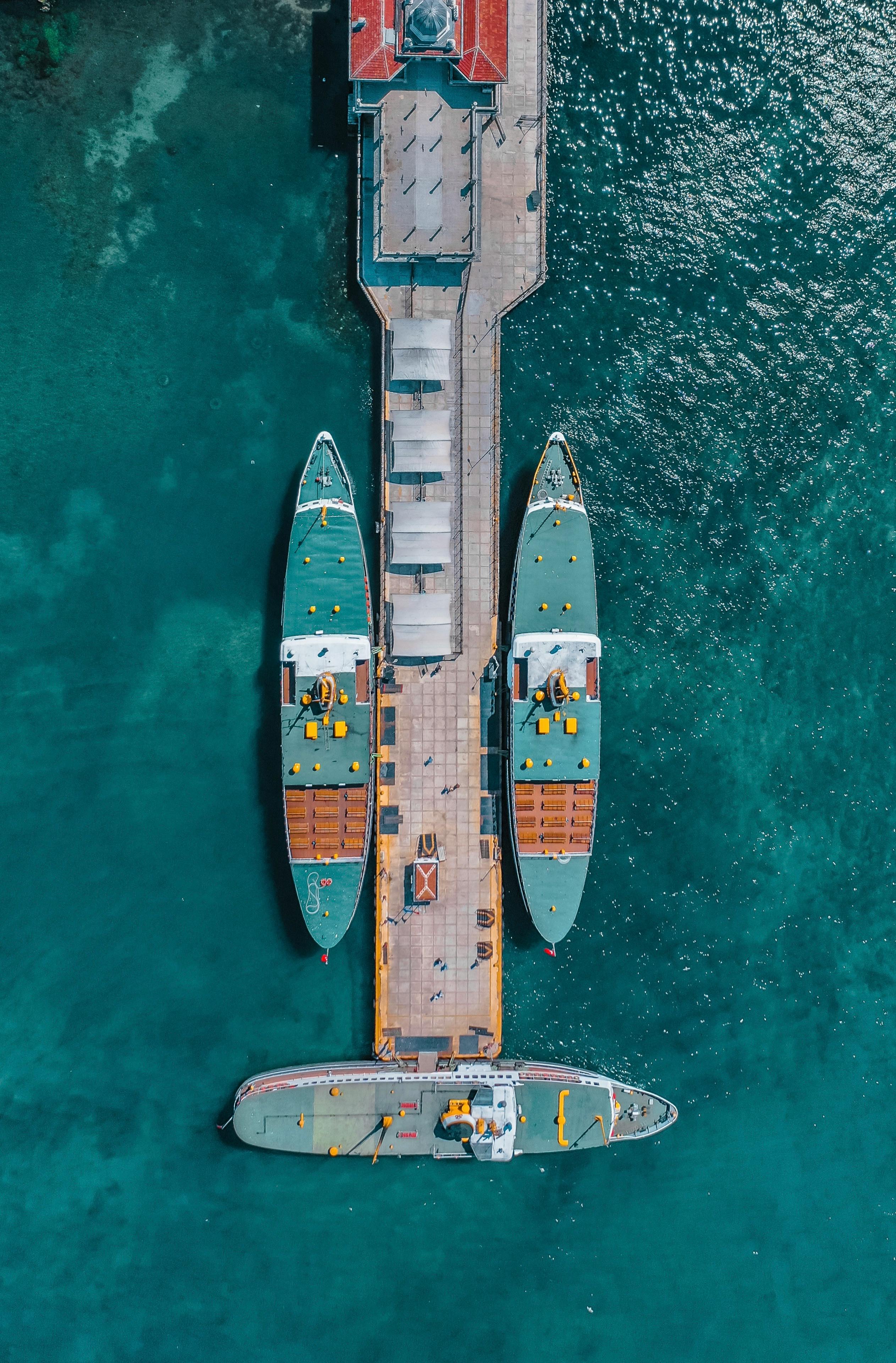 Aerial View of Brown and White Boat on Sea · Free Stock Photo