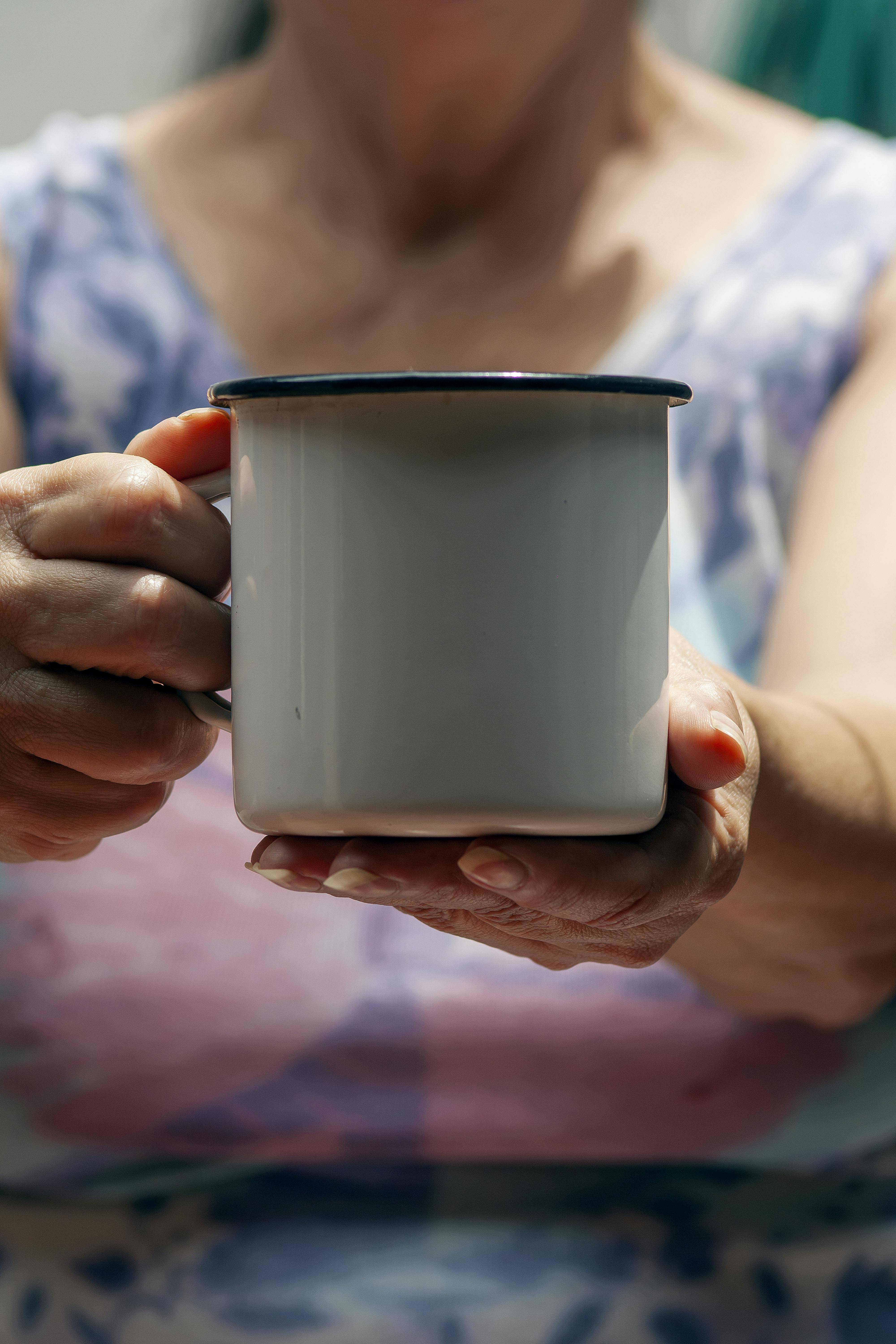 A Person Holding a Cup of Tea · Free Stock Photo