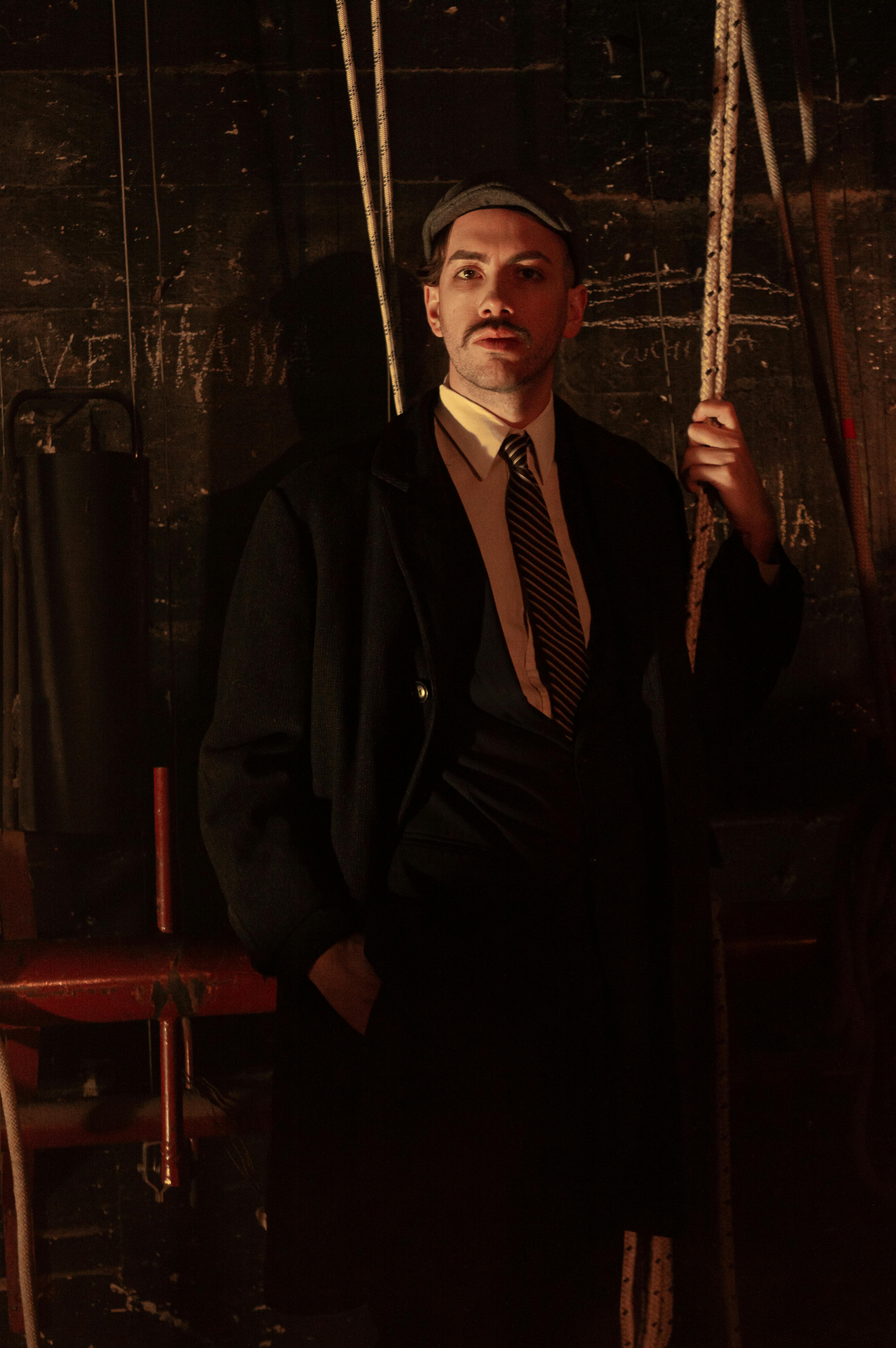 Man in Black Suit holding on a Rope · Free Stock Photo