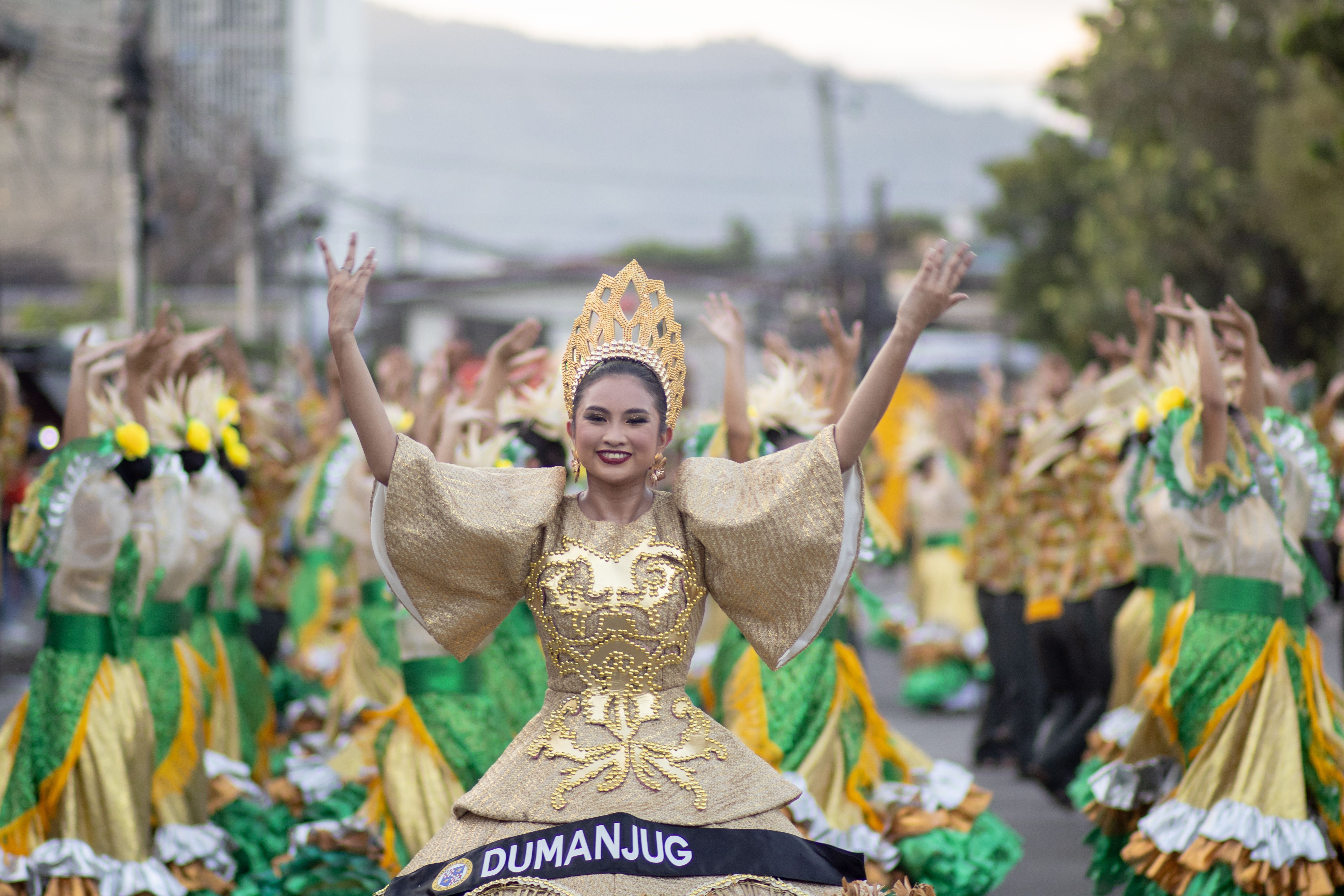 Women in Costumes Dancing on a Parade · Free Stock Photo