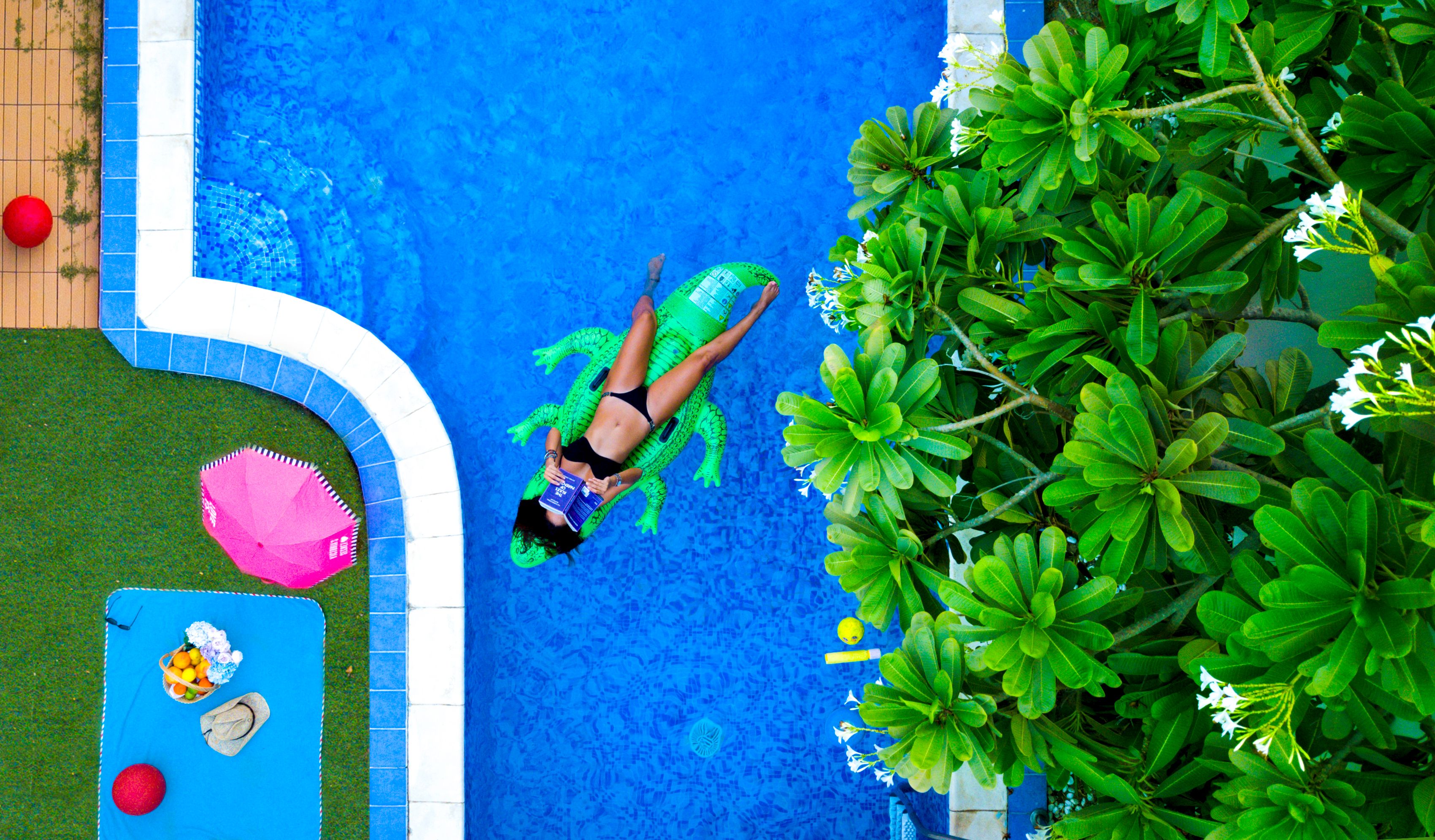 Selective Focus Photo of Woman in a White Bikini Sleeping Poolside ...