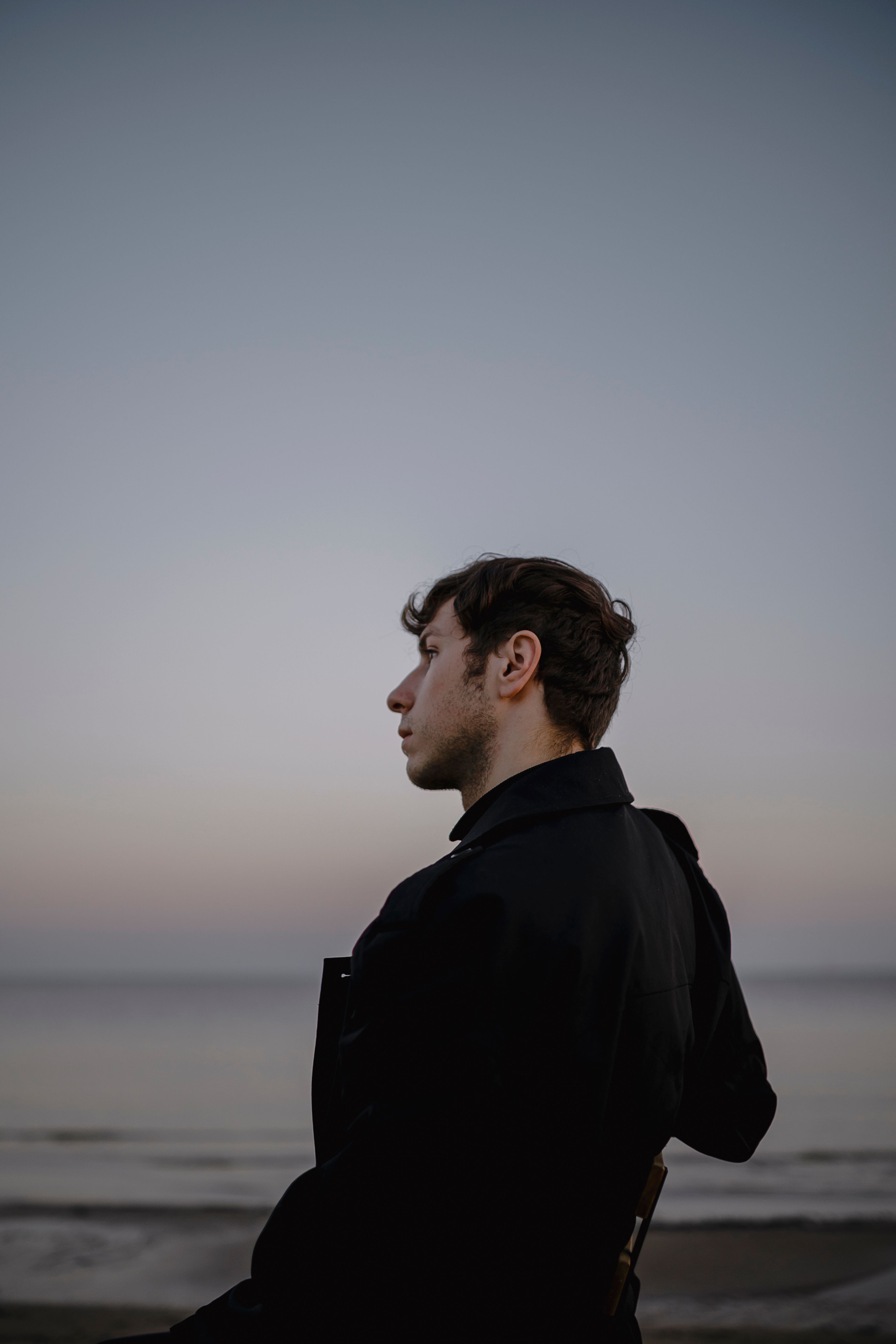 Man on Sea Shore at Dusk · Free Stock Photo
