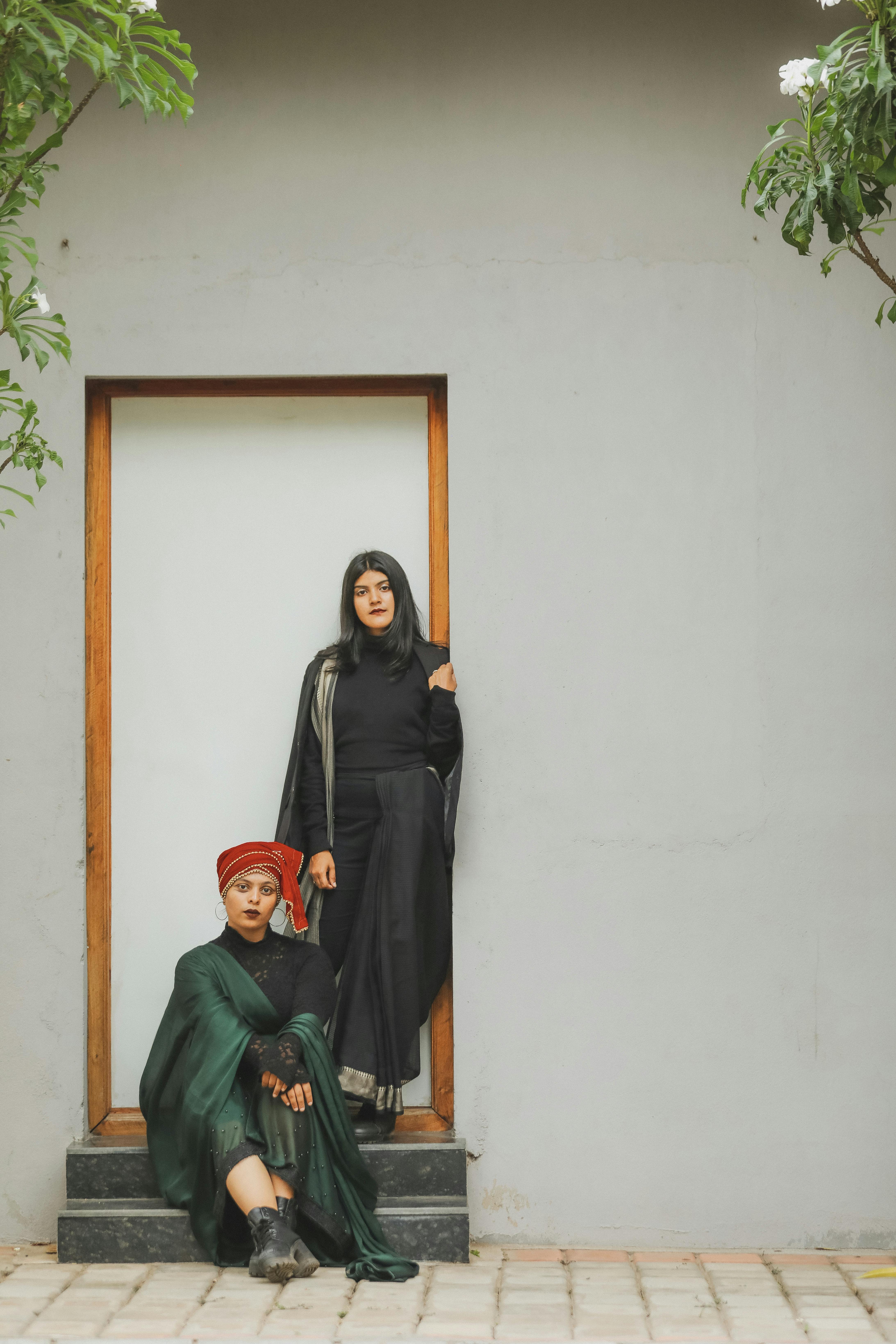 Two Women in Black Traditional Clothing · Free Stock Photo