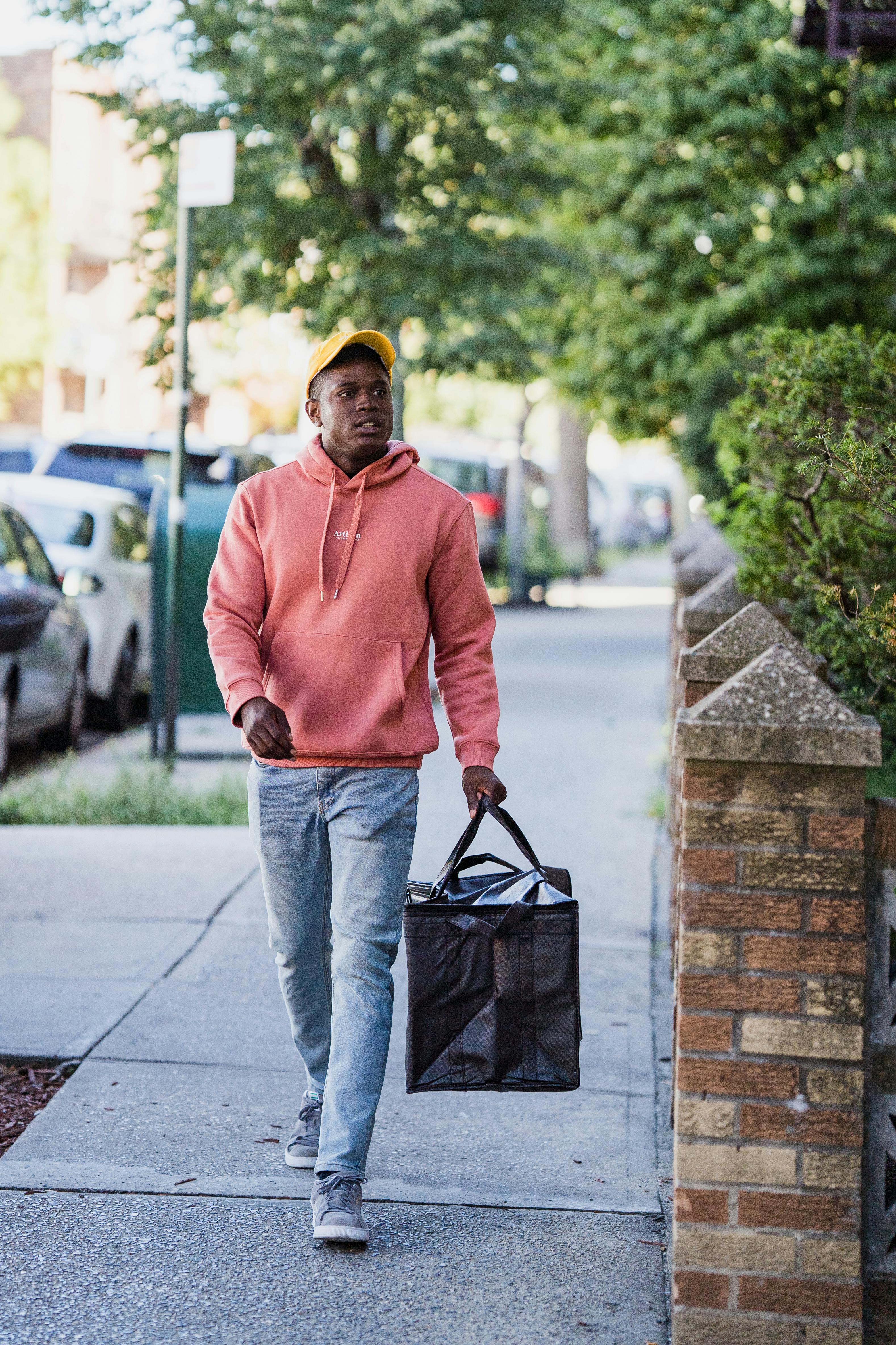 Man Walking with Bag · Free Stock Photo