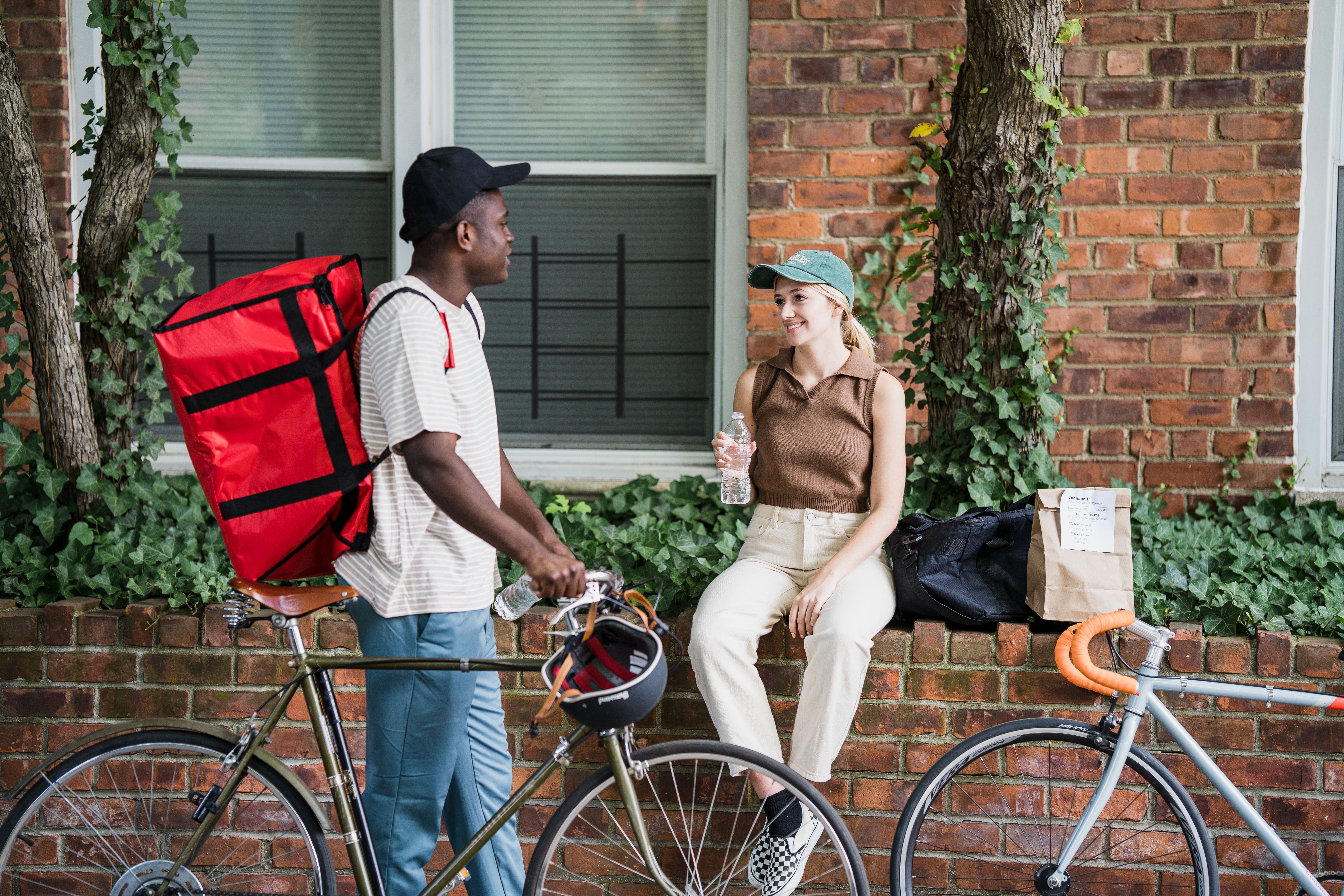 Courier Delivering Order to Client · Free Stock Photo