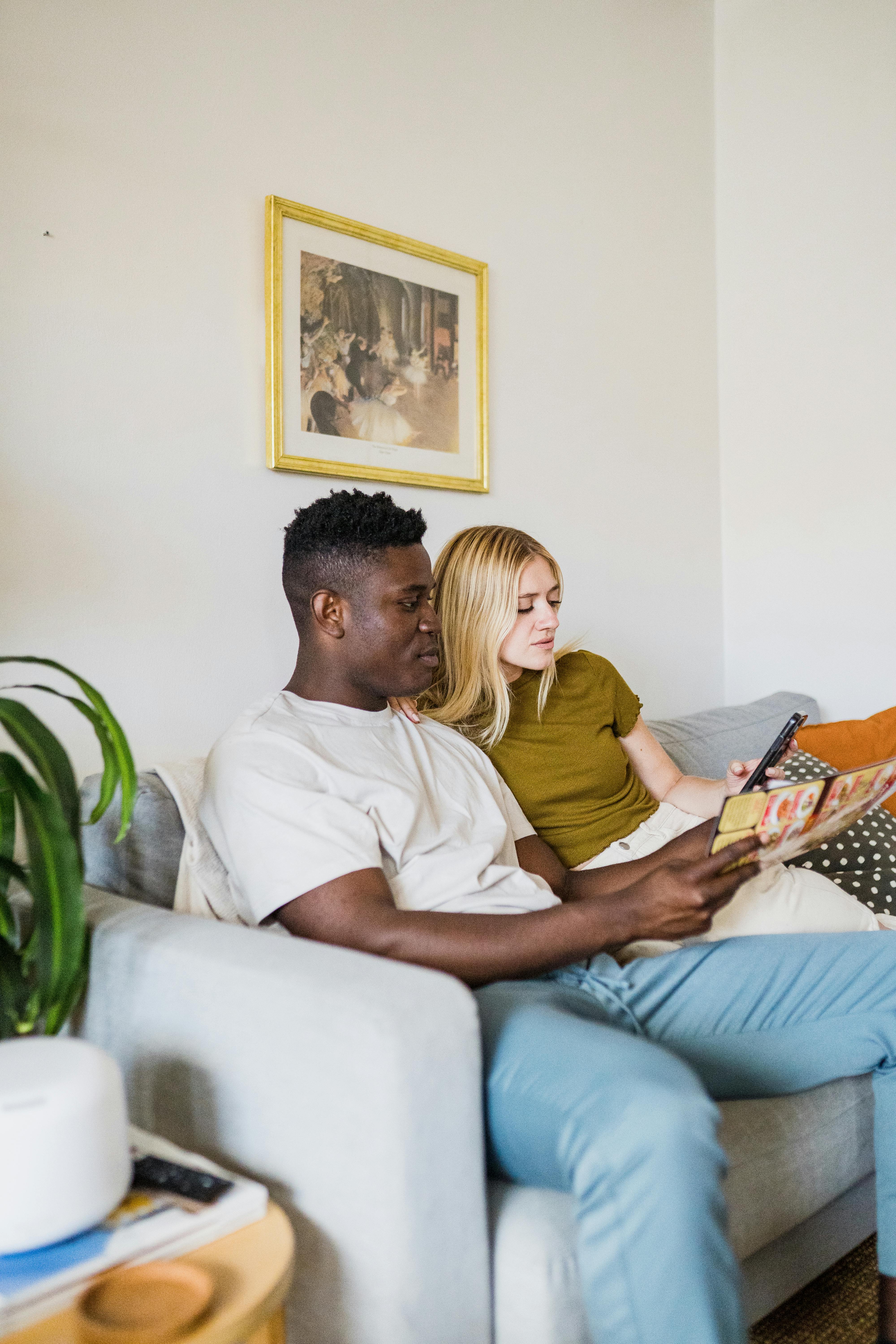 People Relaxing Together in Living Room Sofa · Free Stock Photo