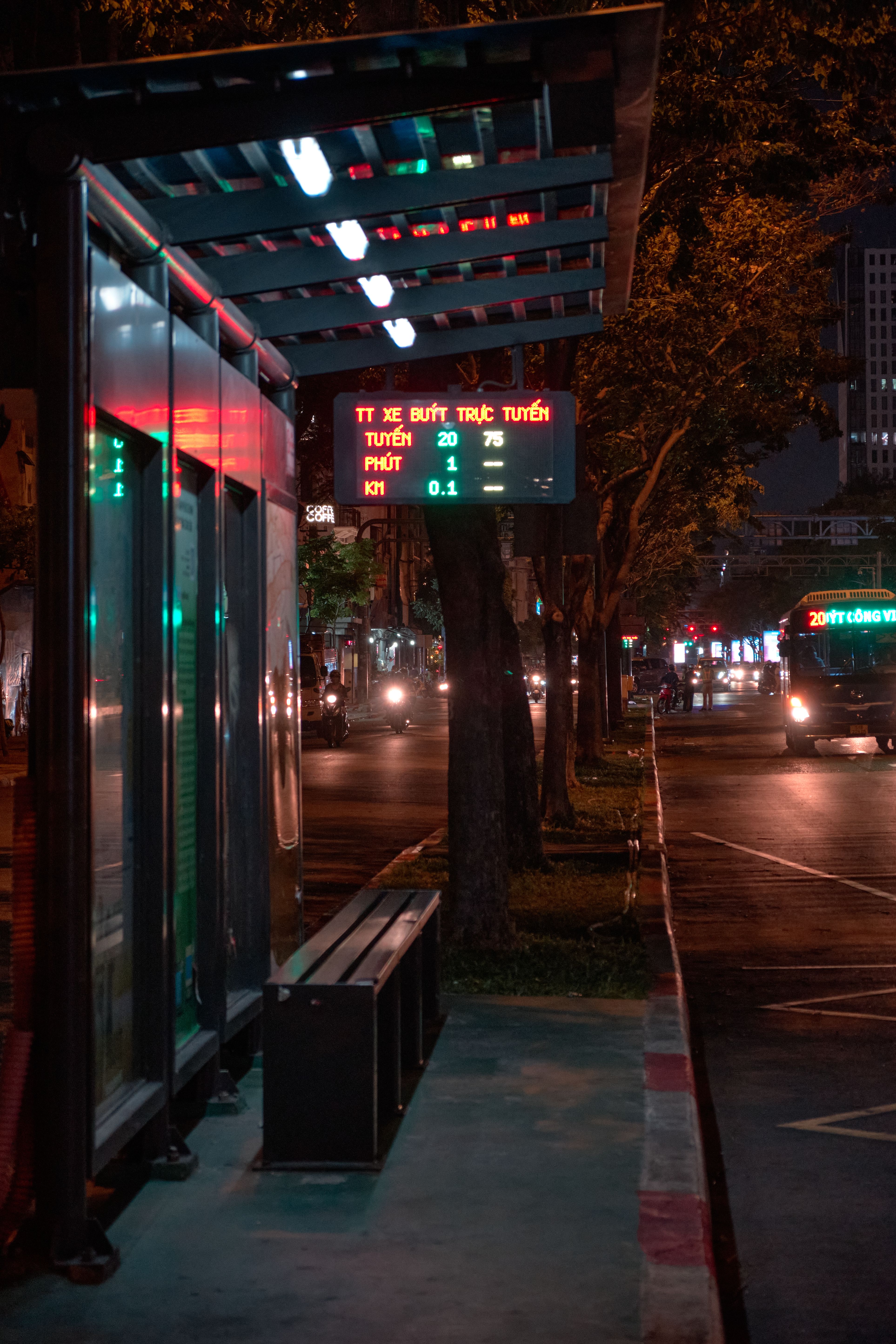 Illuminated Bus Stop on Sidewalk · Free Stock Photo