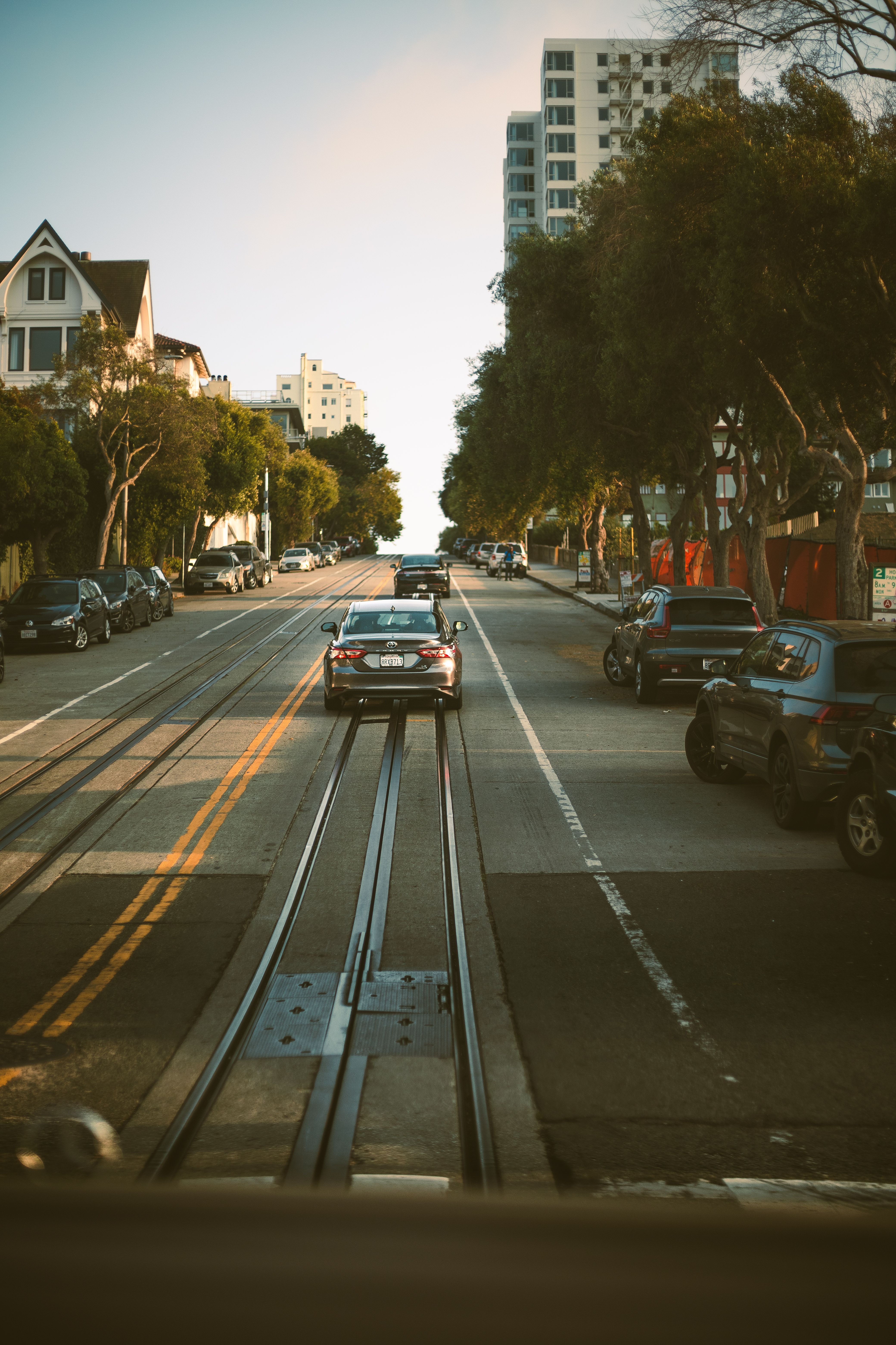 A Car Running on Tram Tracks · Free Stock Photo