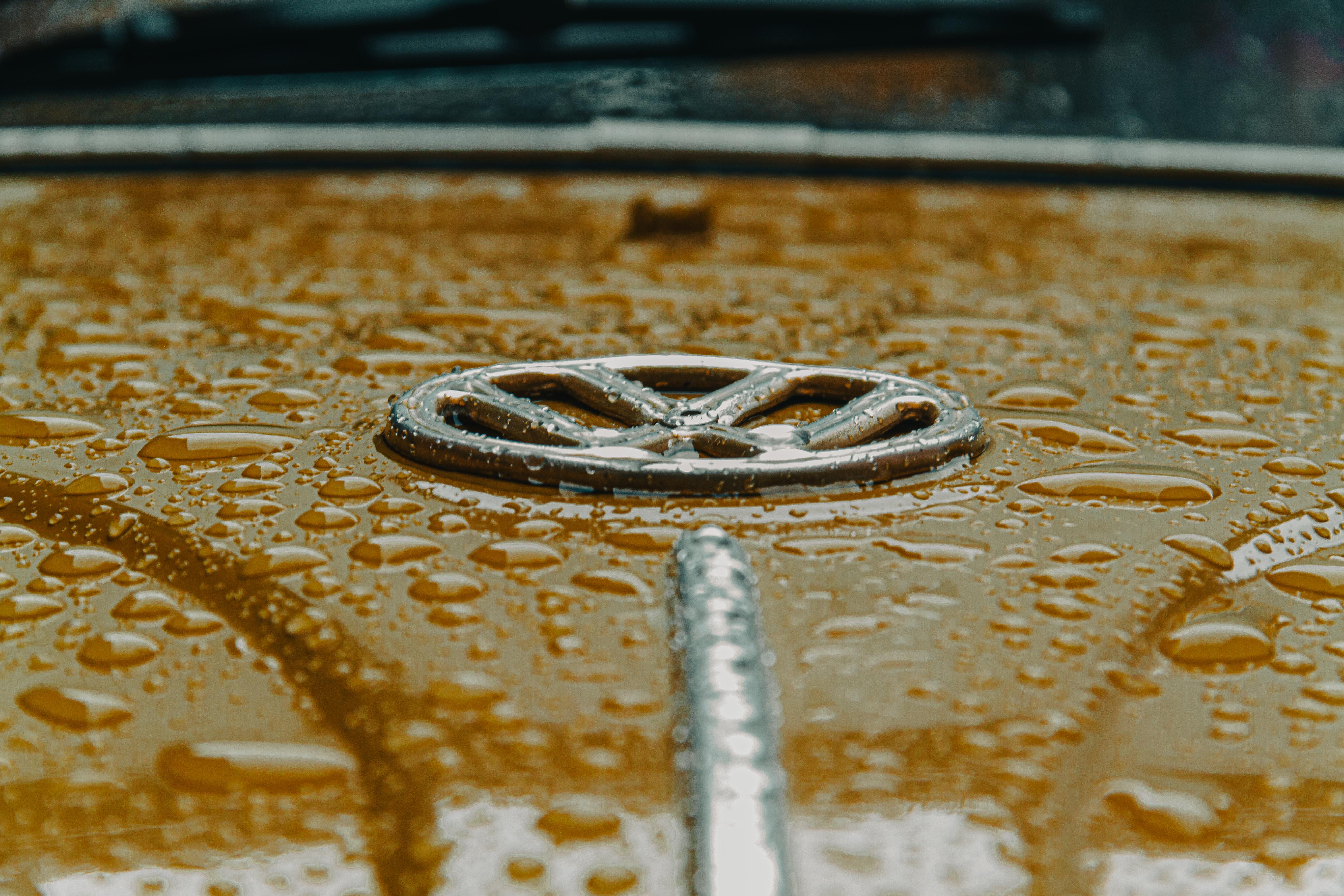 A Close-Up Shot of a Volkswagen Emblem · Free Stock Photo