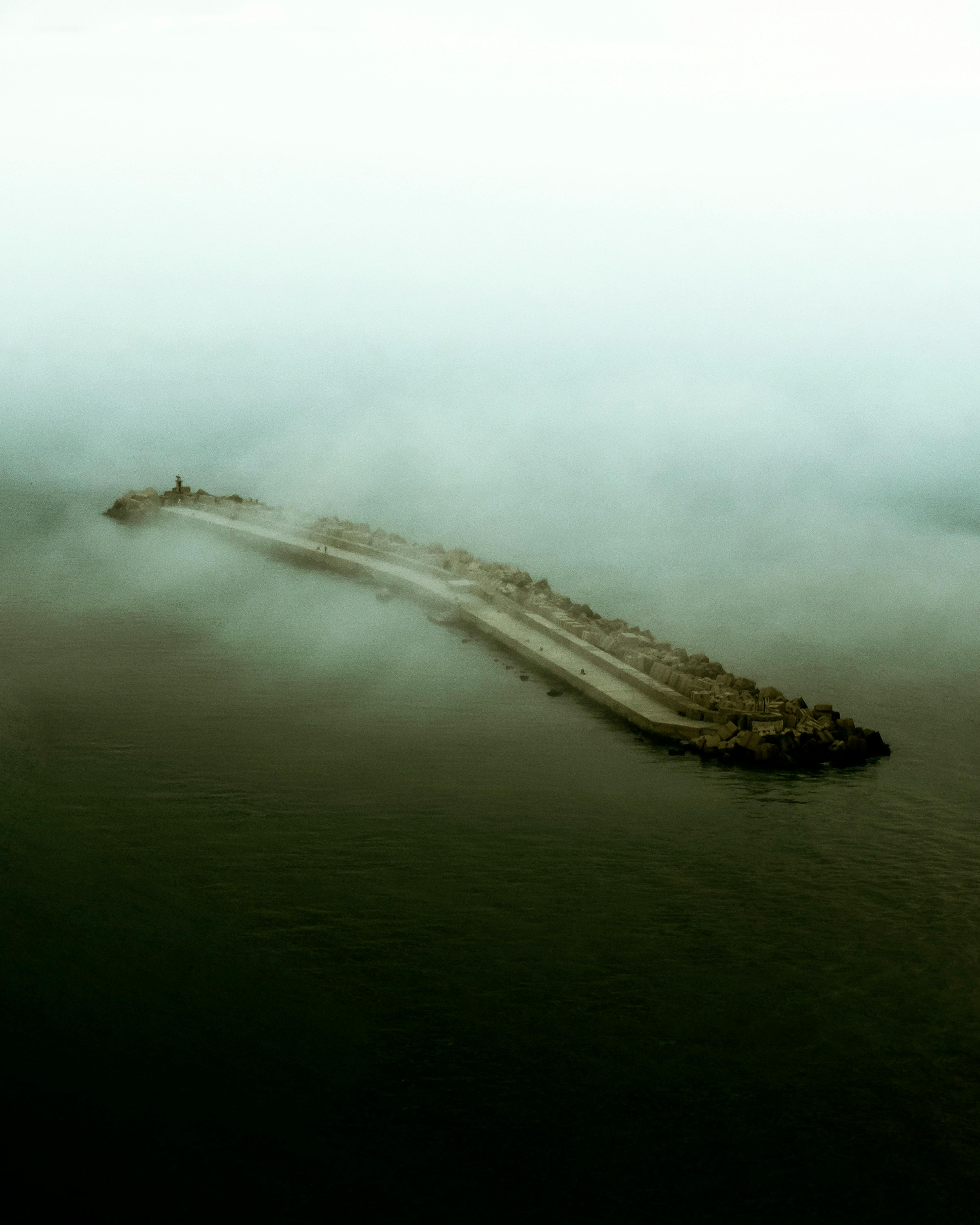 Aerial View of an Island in Fog · Free Stock Photo