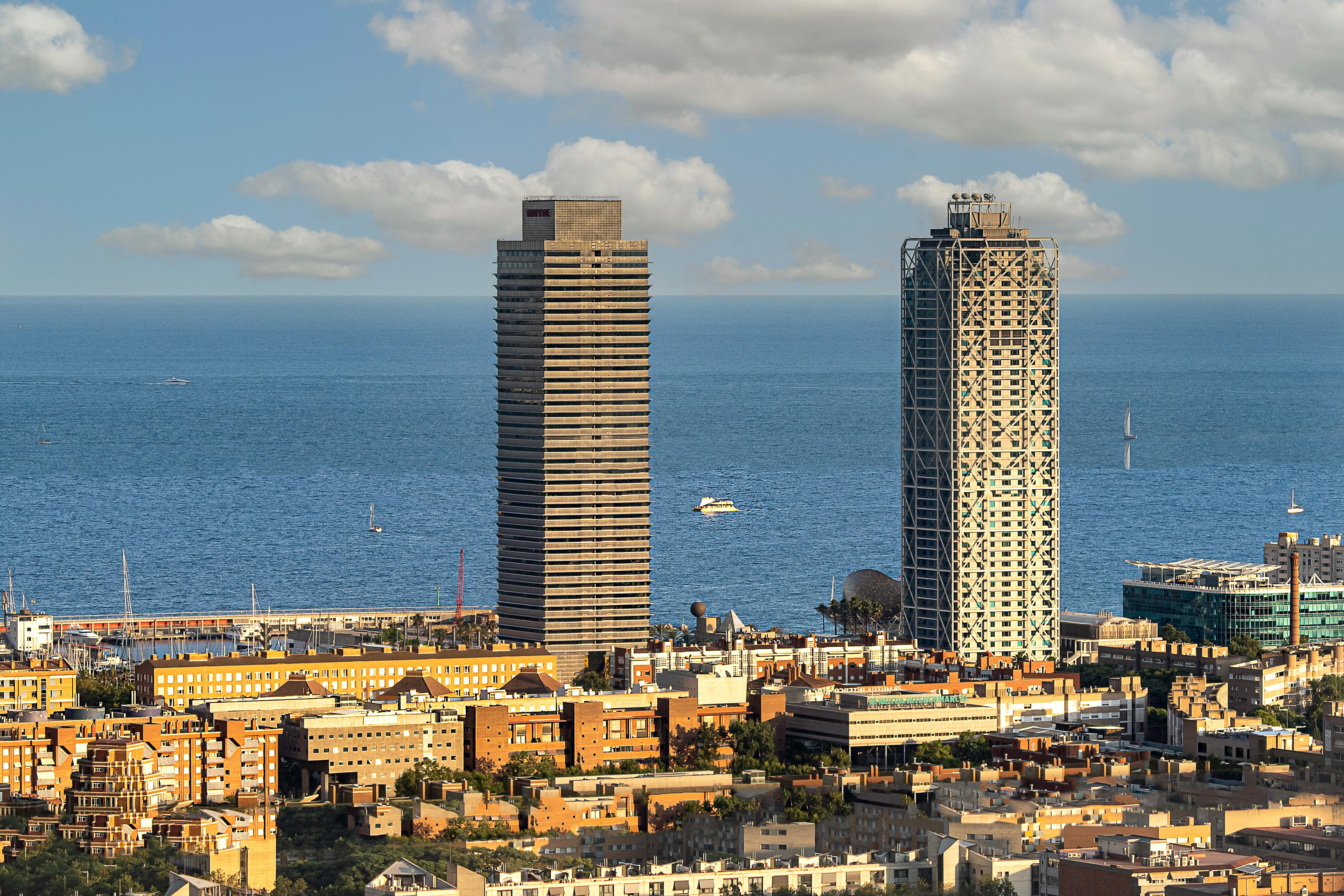 Skyscrapers on Sea Coast in Barcelona · Free Stock Photo