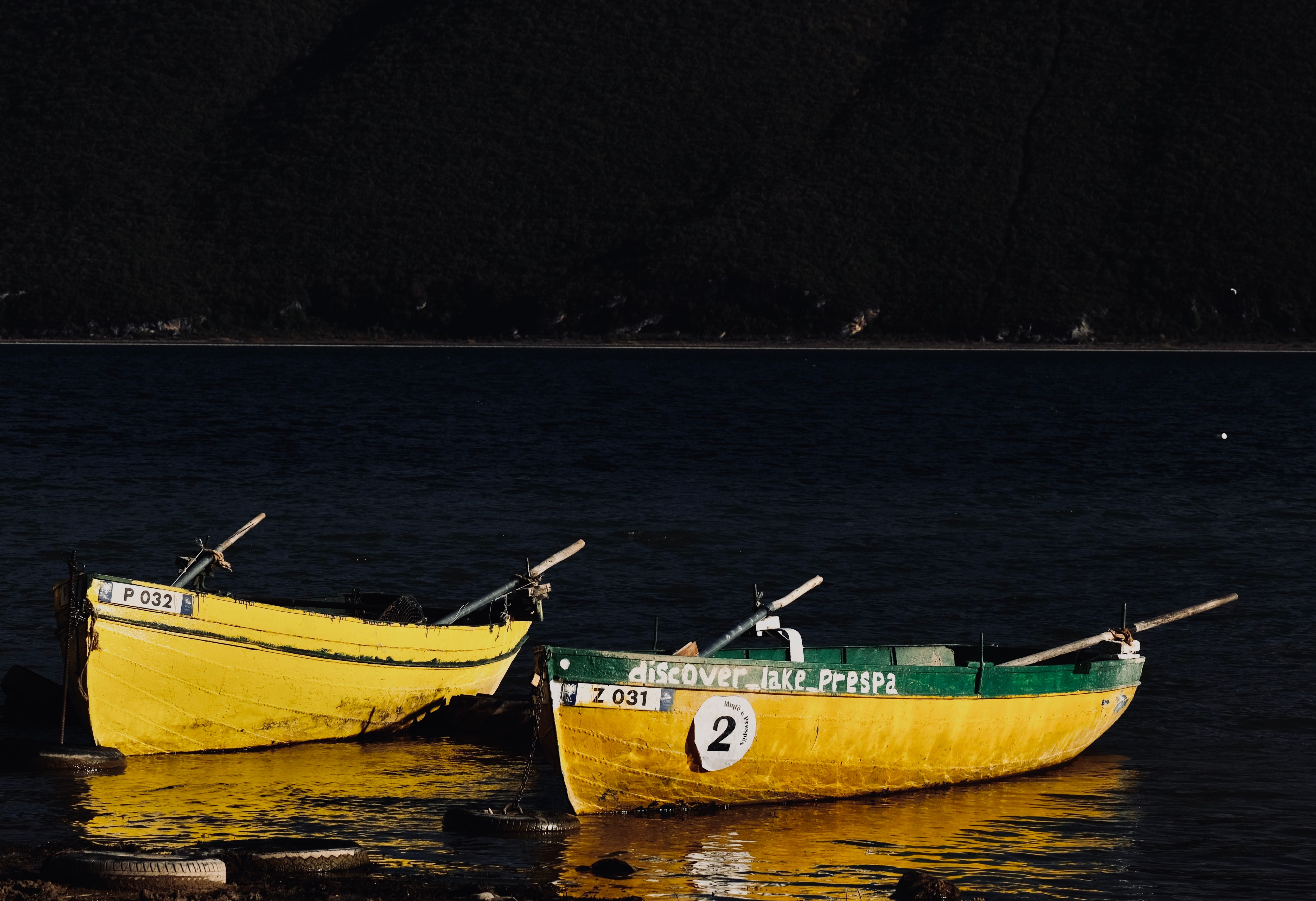 Yellow Boats on body of Water · Free Stock Photo