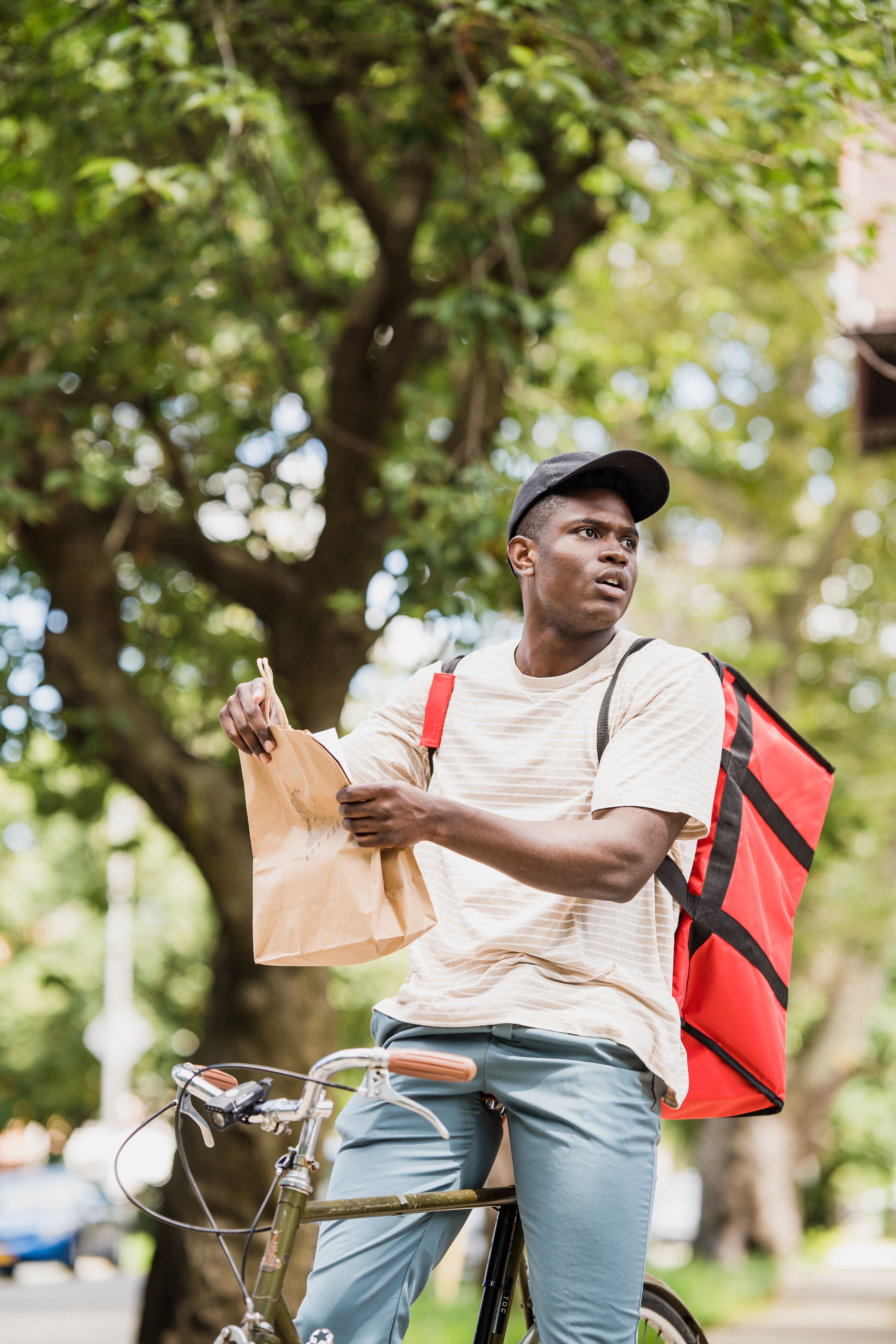 Deliveryman with Red Backpack · Free Stock Photo
