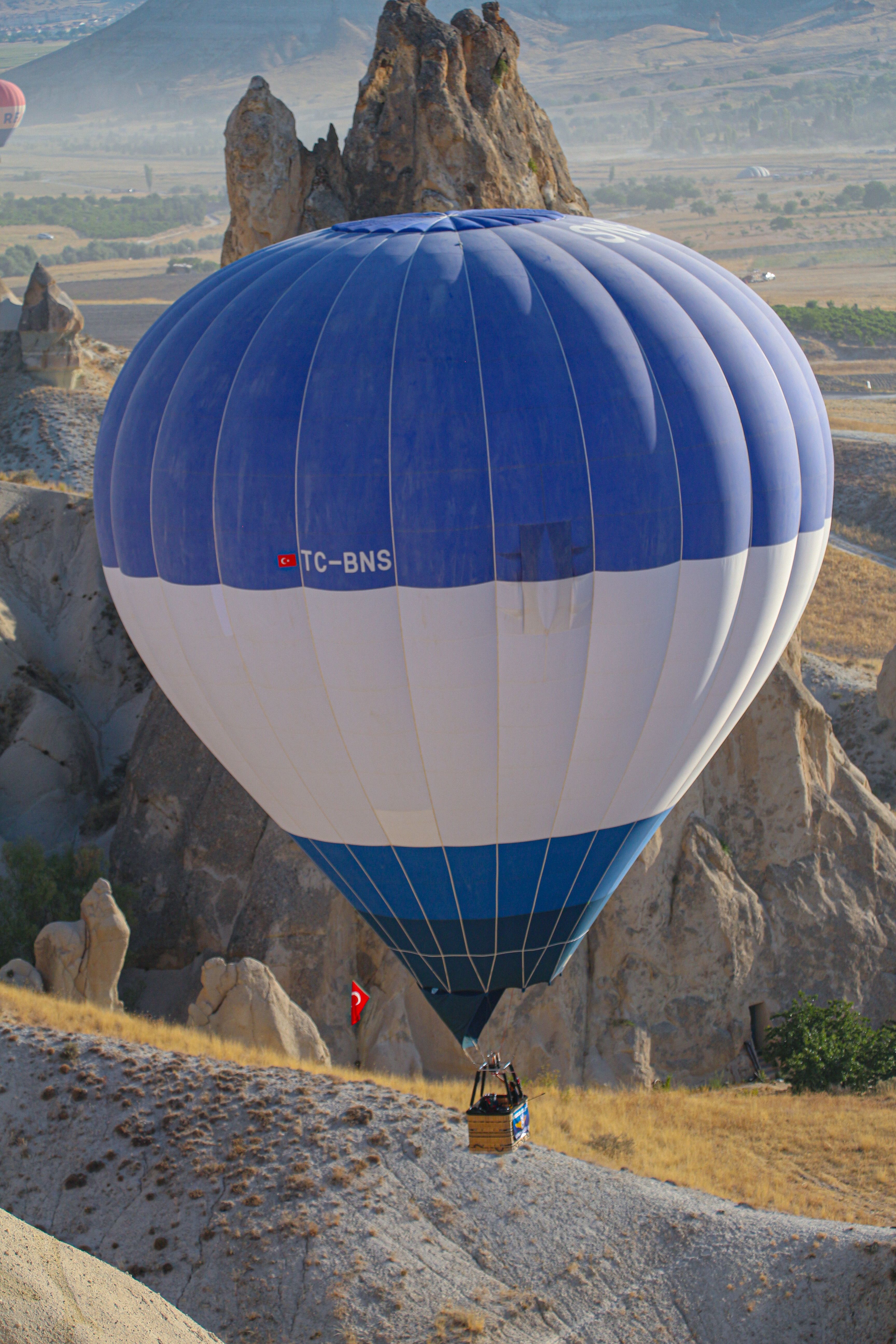 Hot Air Balloon Flying Above the Mountain · Free Stock Photo