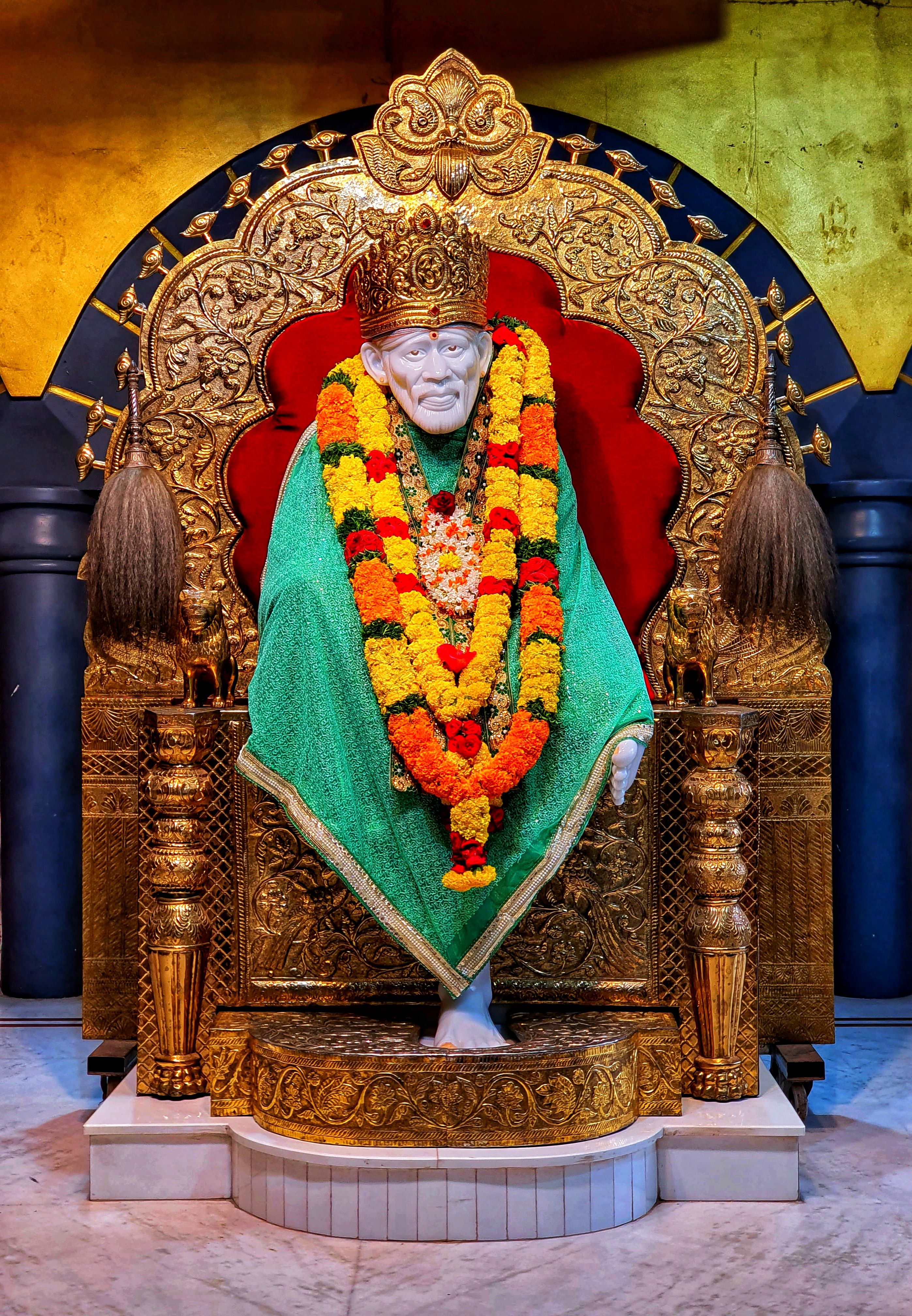 Sai Baba Statue Dressed in Bright Clothes Adorned with Flower Wreath ...