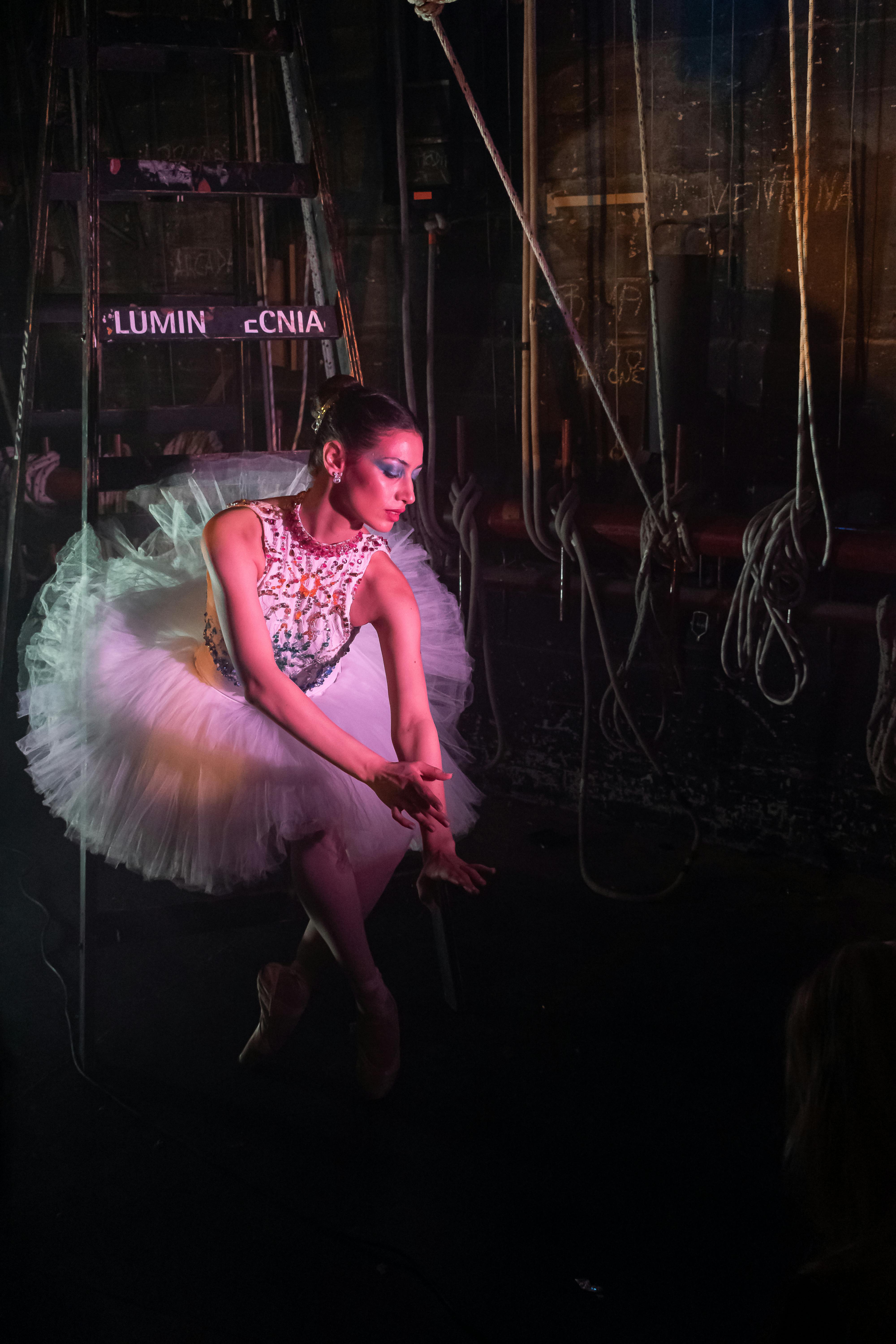 Woman in Pink Ballet Costume Sitting On Floor · Free Stock Photo