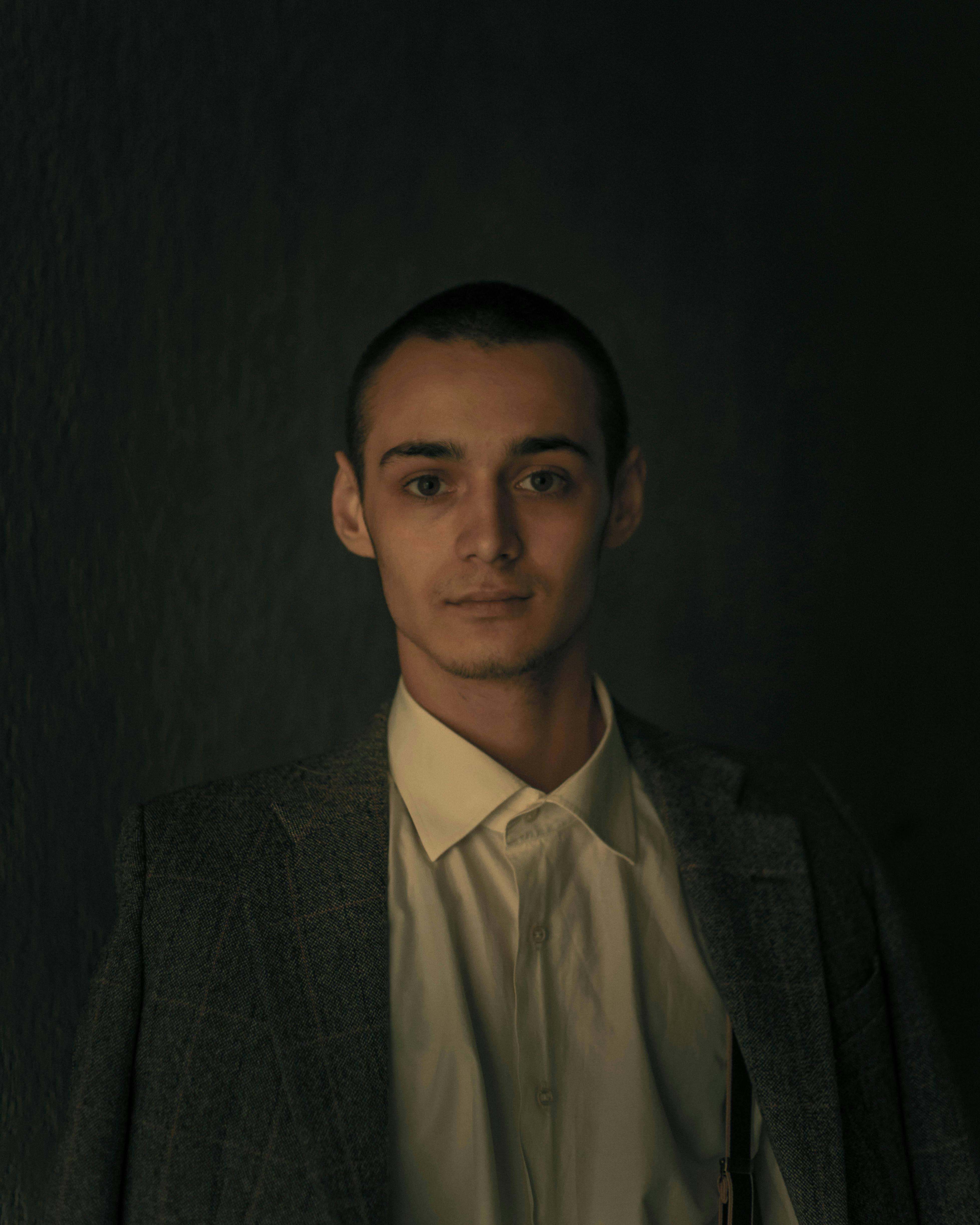 A Man with a Lighted Match on His Mouth · Free Stock Photo