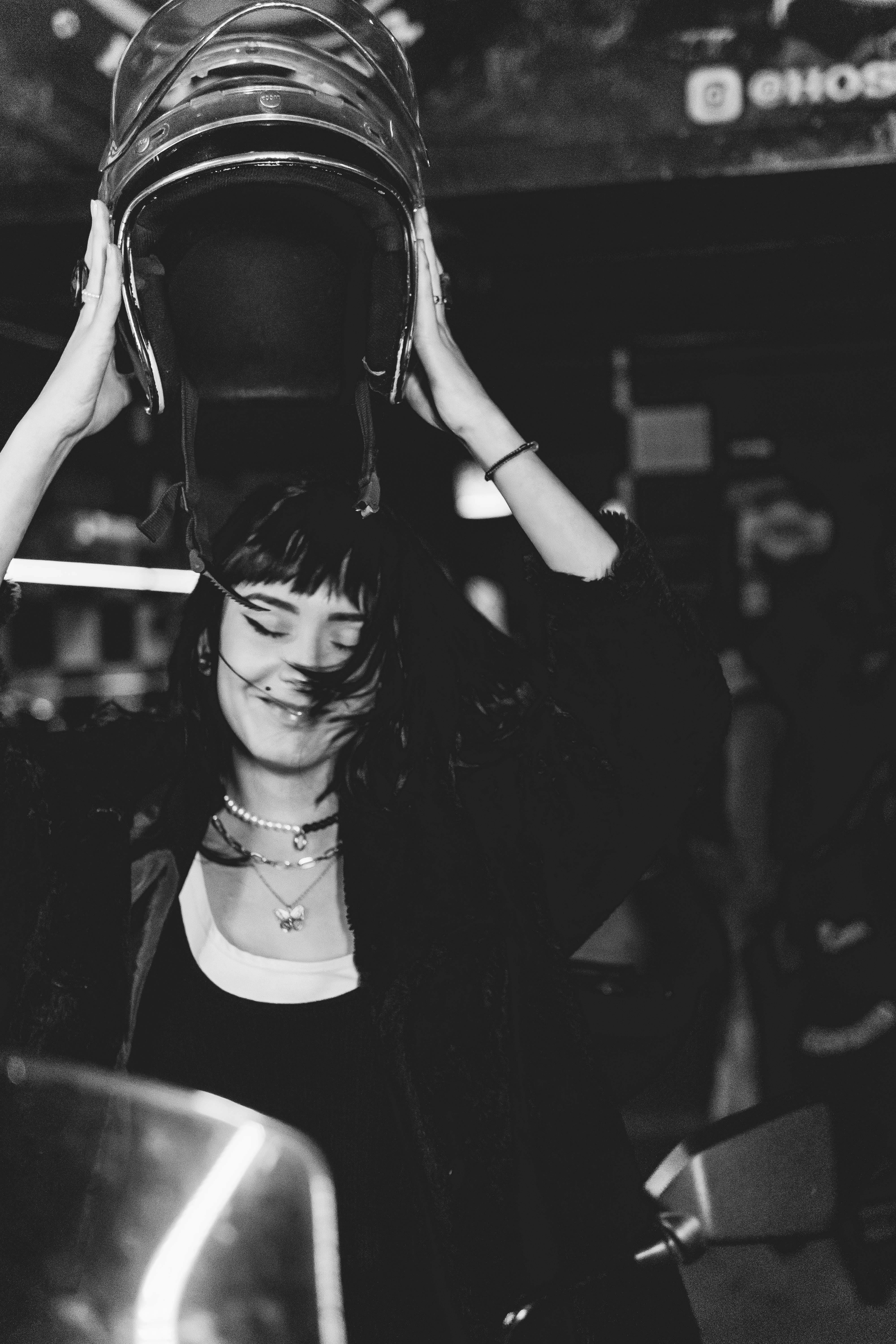 Woman Removing her Helmet · Free Stock Photo