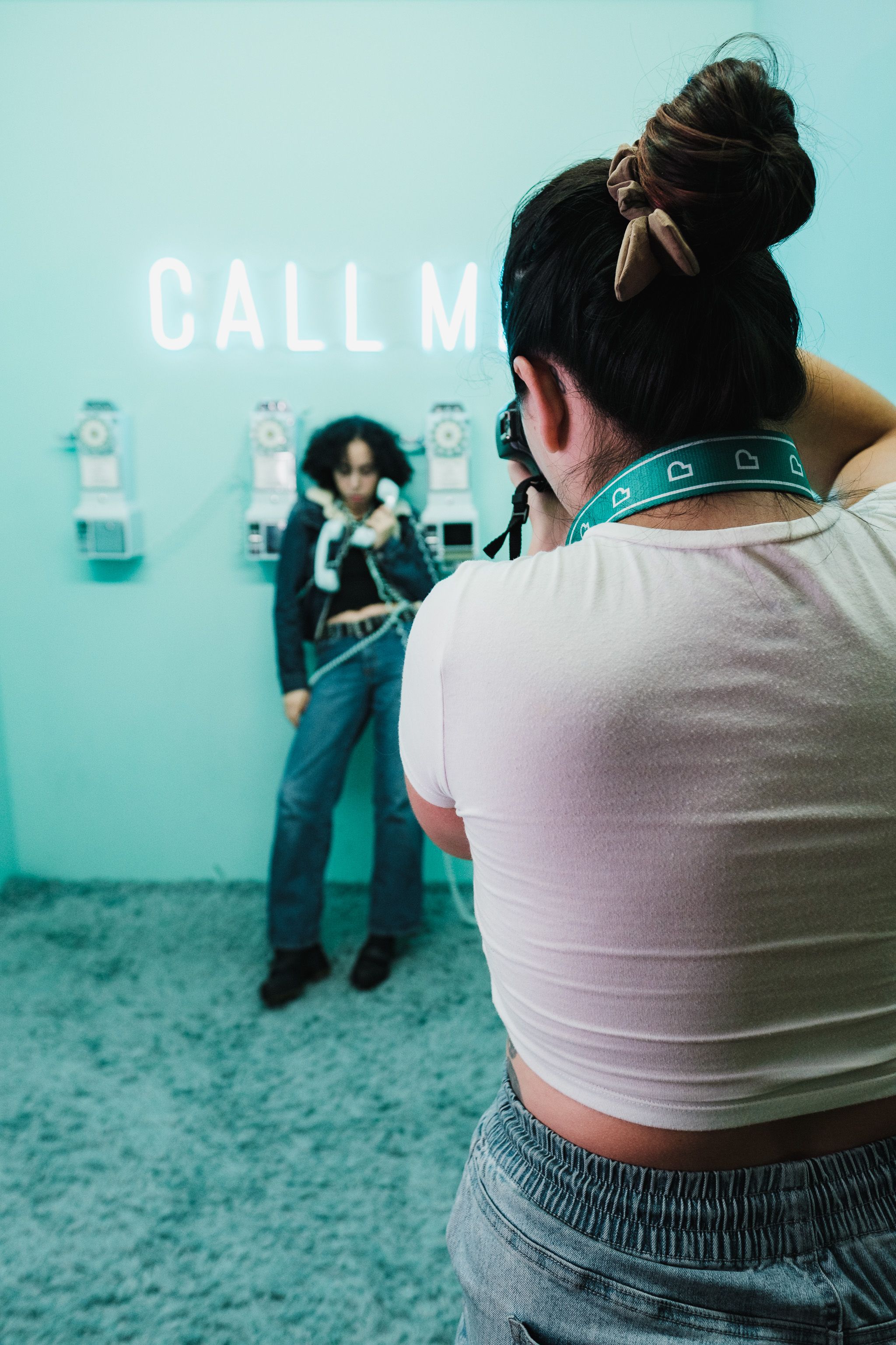 Back View of Photographer Taking Pictures of Model · Free Stock Photo
