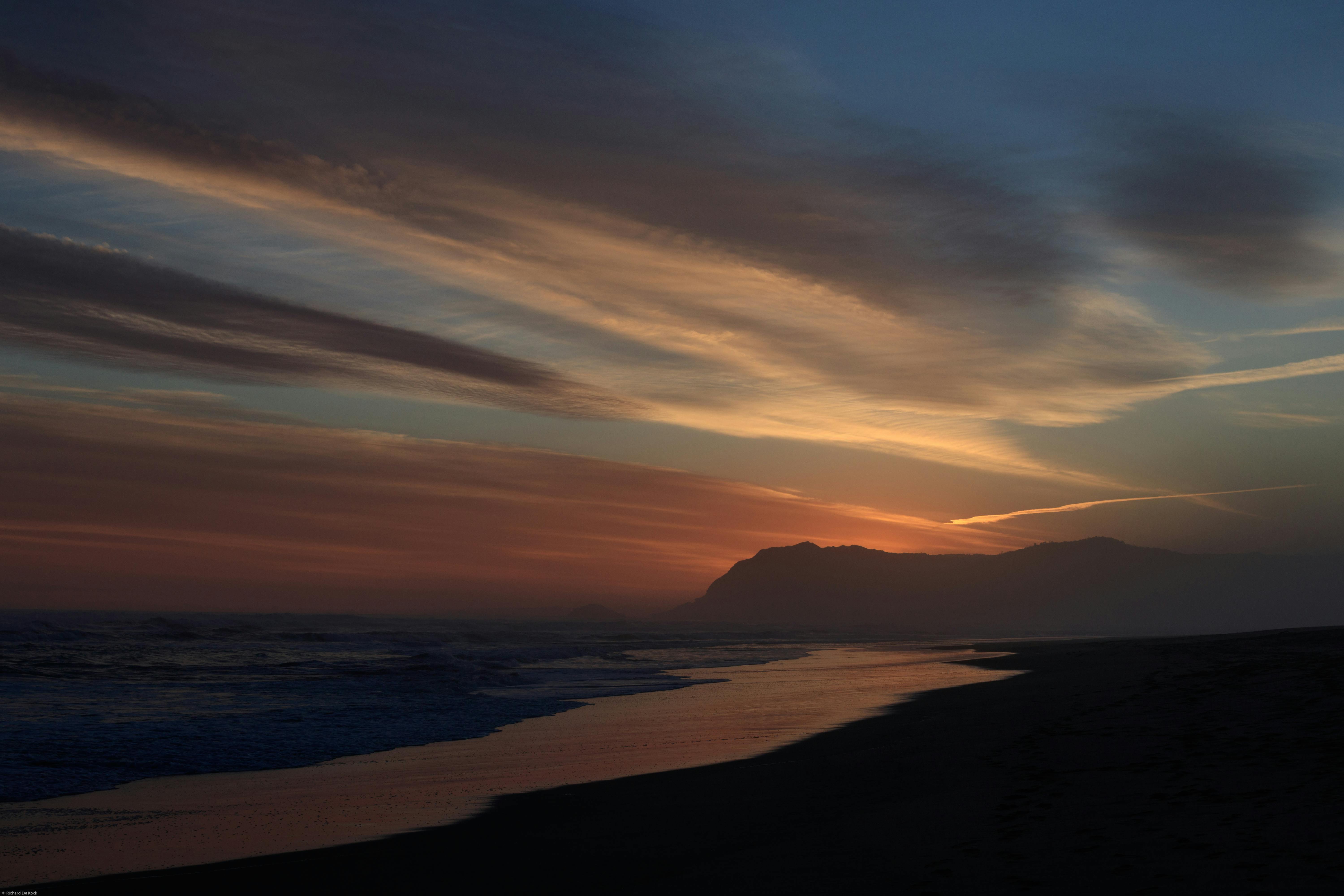 Clouds over Beach at Sunset · Free Stock Photo