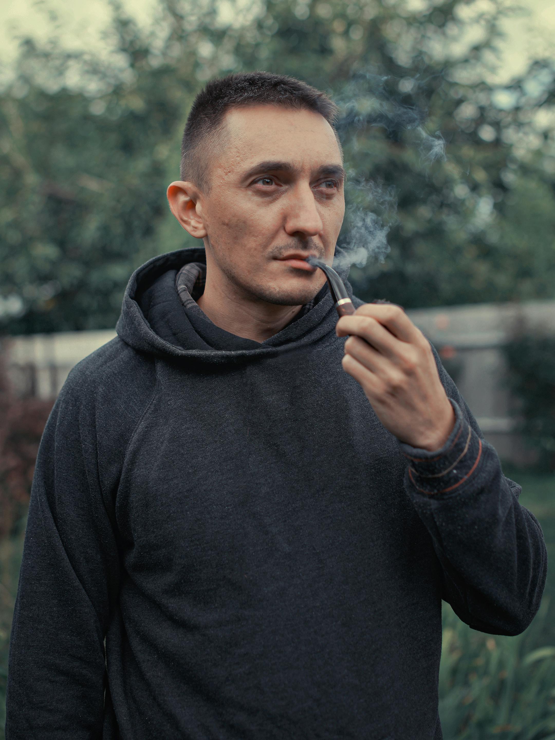 Portrait of a man with a smoking pipe · Free Stock Photo