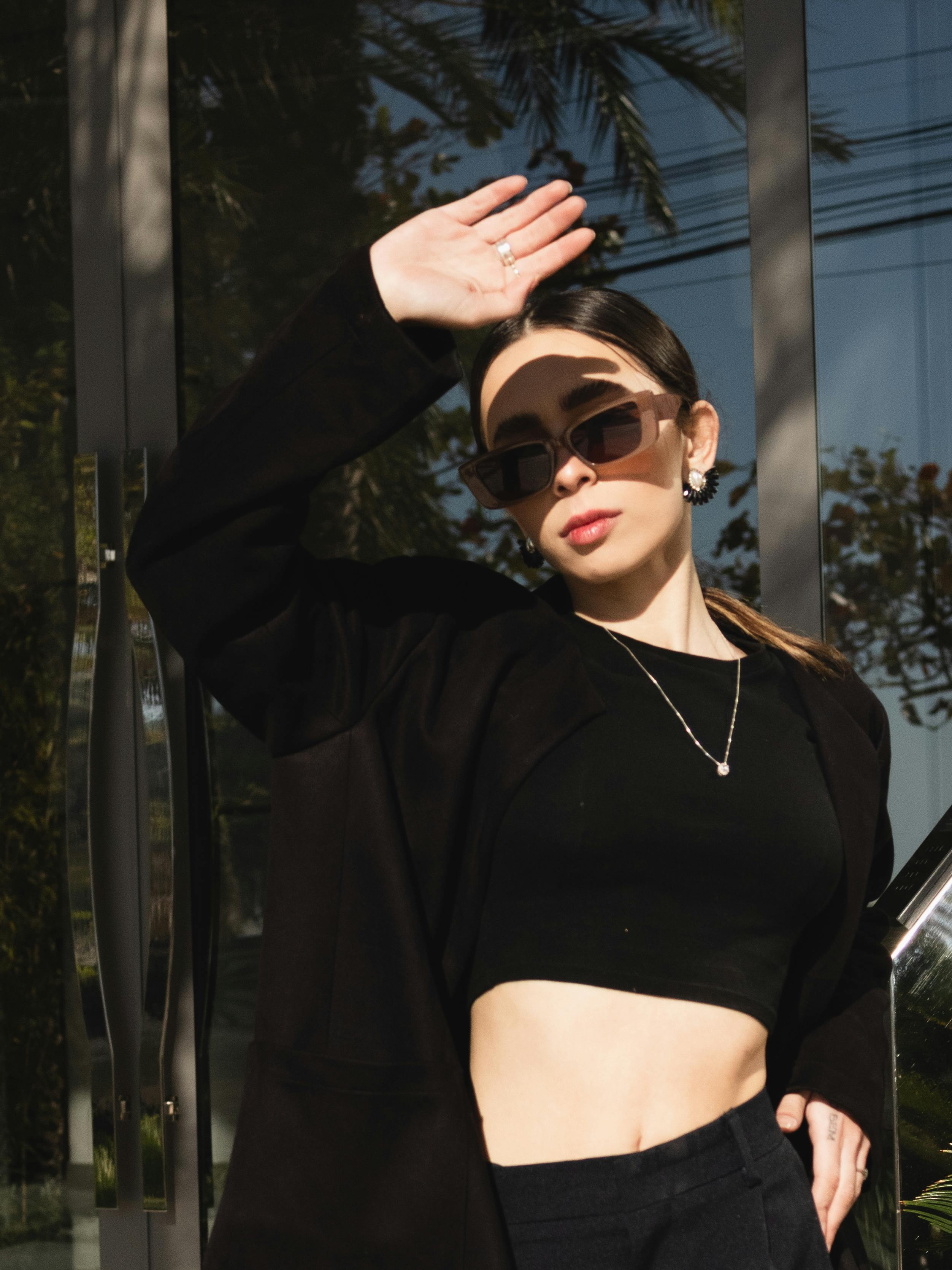 Back Lit Profile of Woman with Arms Raised · Free Stock Photo