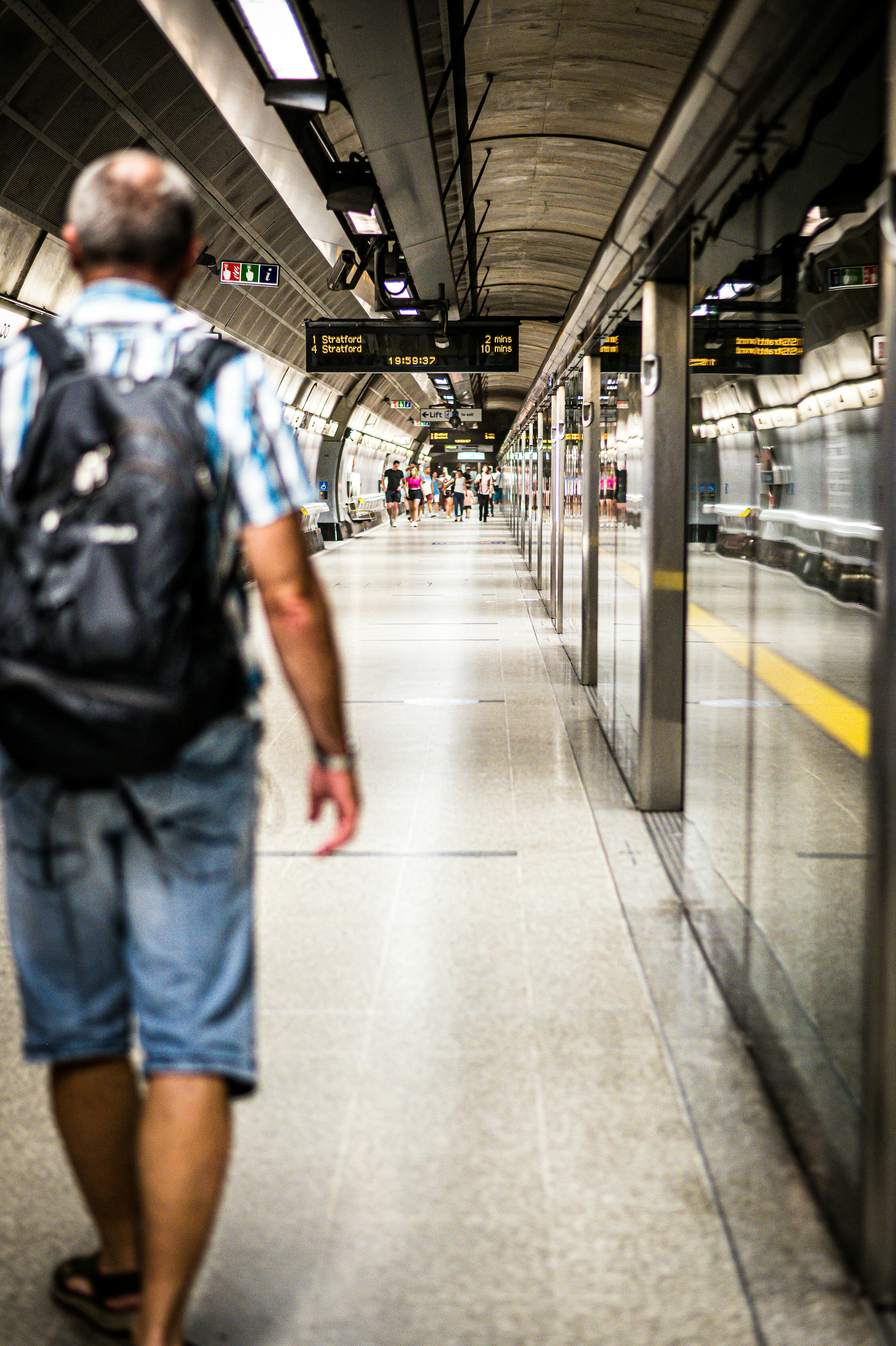 Man Walking on a Train Station · Free Stock Photo