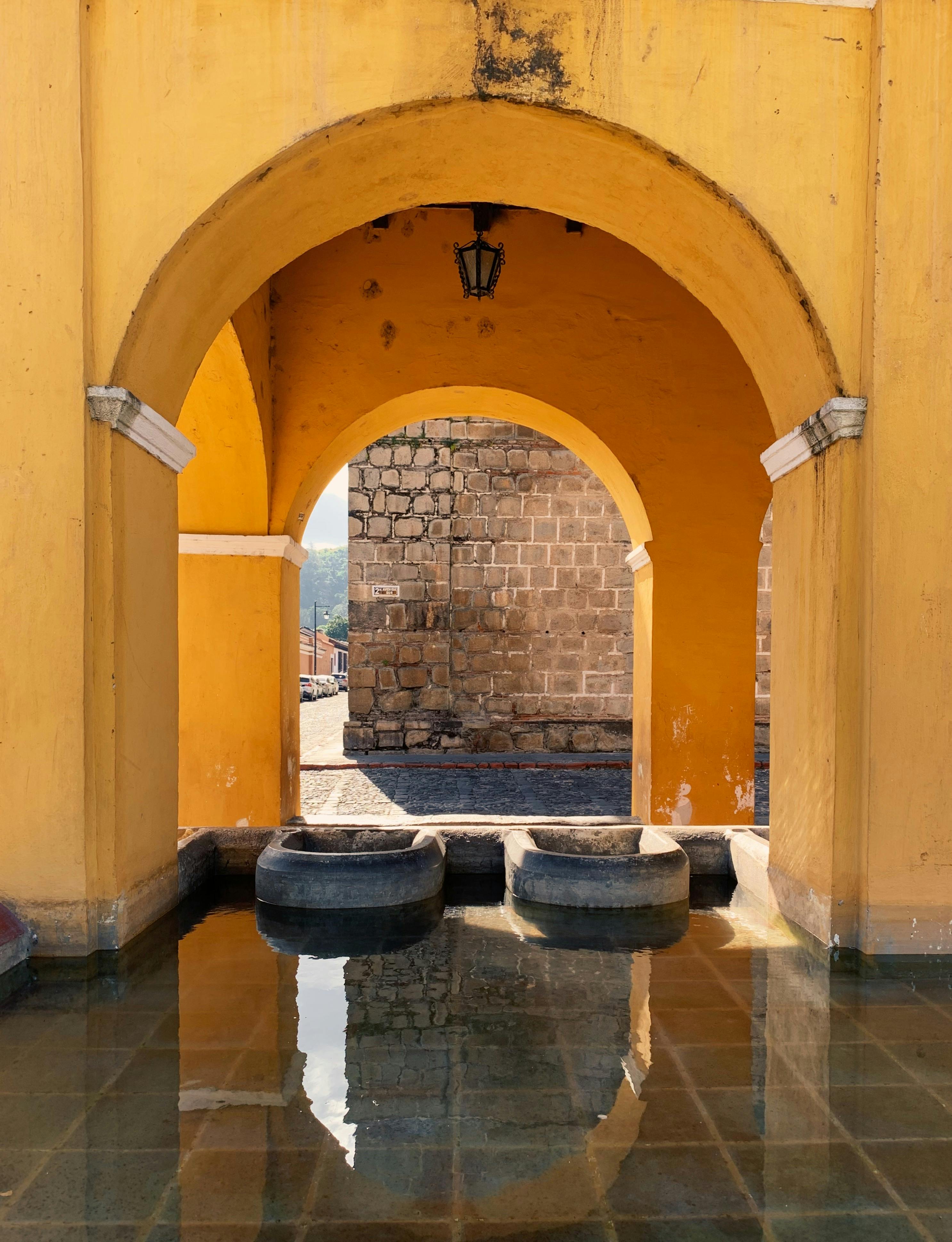 Yellow Wall and Arches in Building · Free Stock Photo