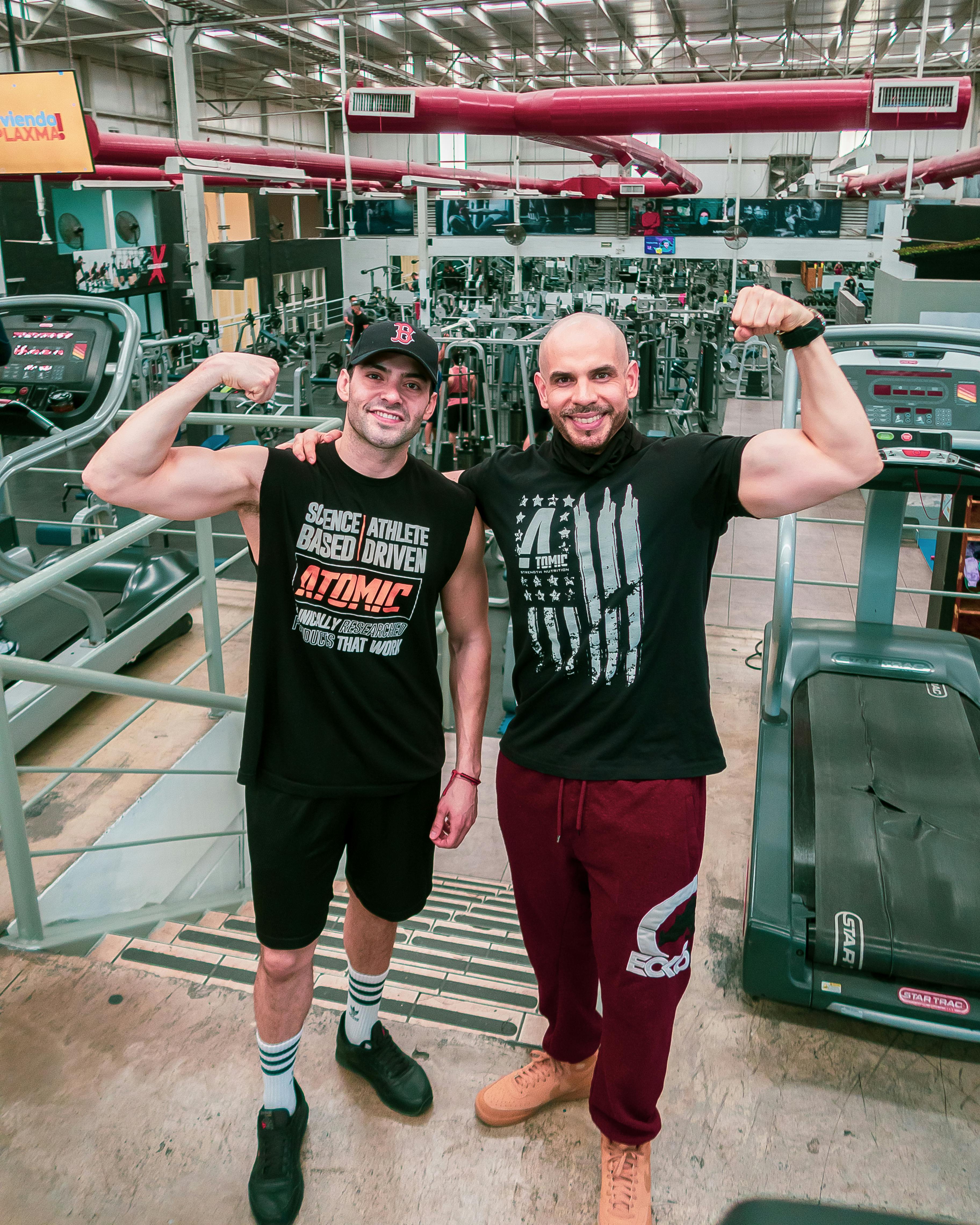 Men Standing Beside Each Other Flexing Their Biceps · Free Stock Photo