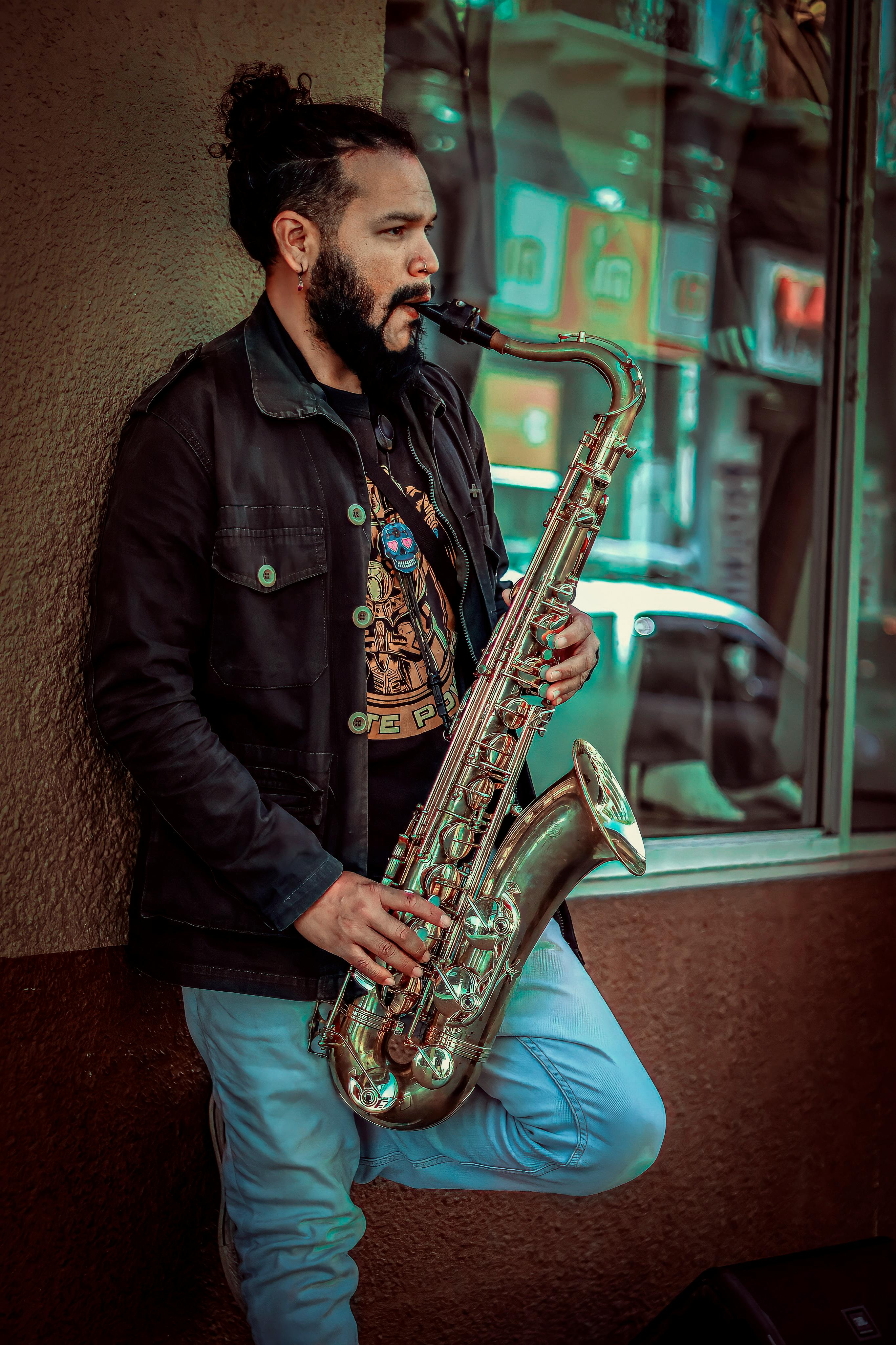 A Street Musician Playing a Saxophone · Free Stock Photo