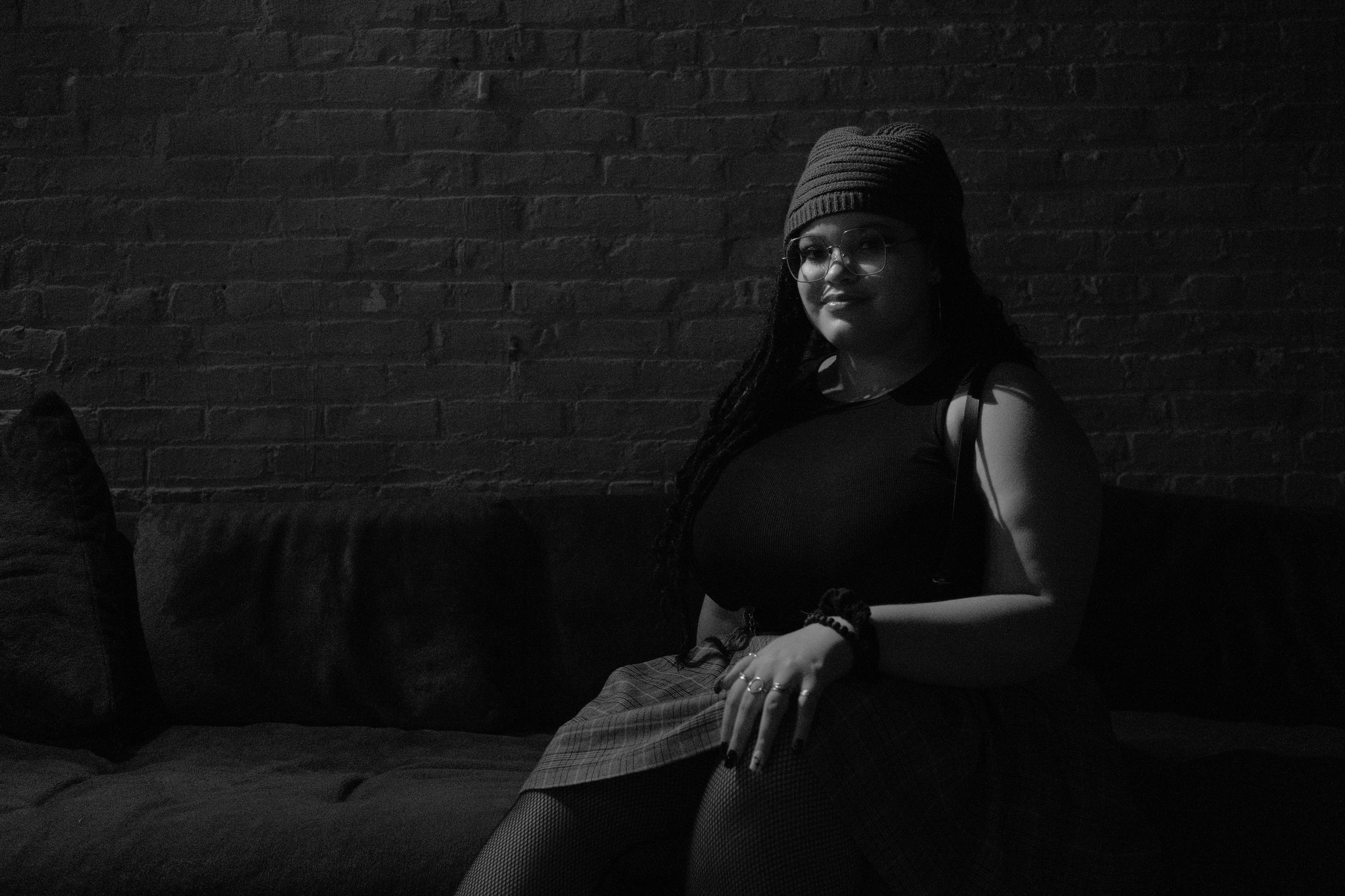 Grayscale Photo of a Beautiful Woman Wearing a Knit Cap · Free Stock Photo