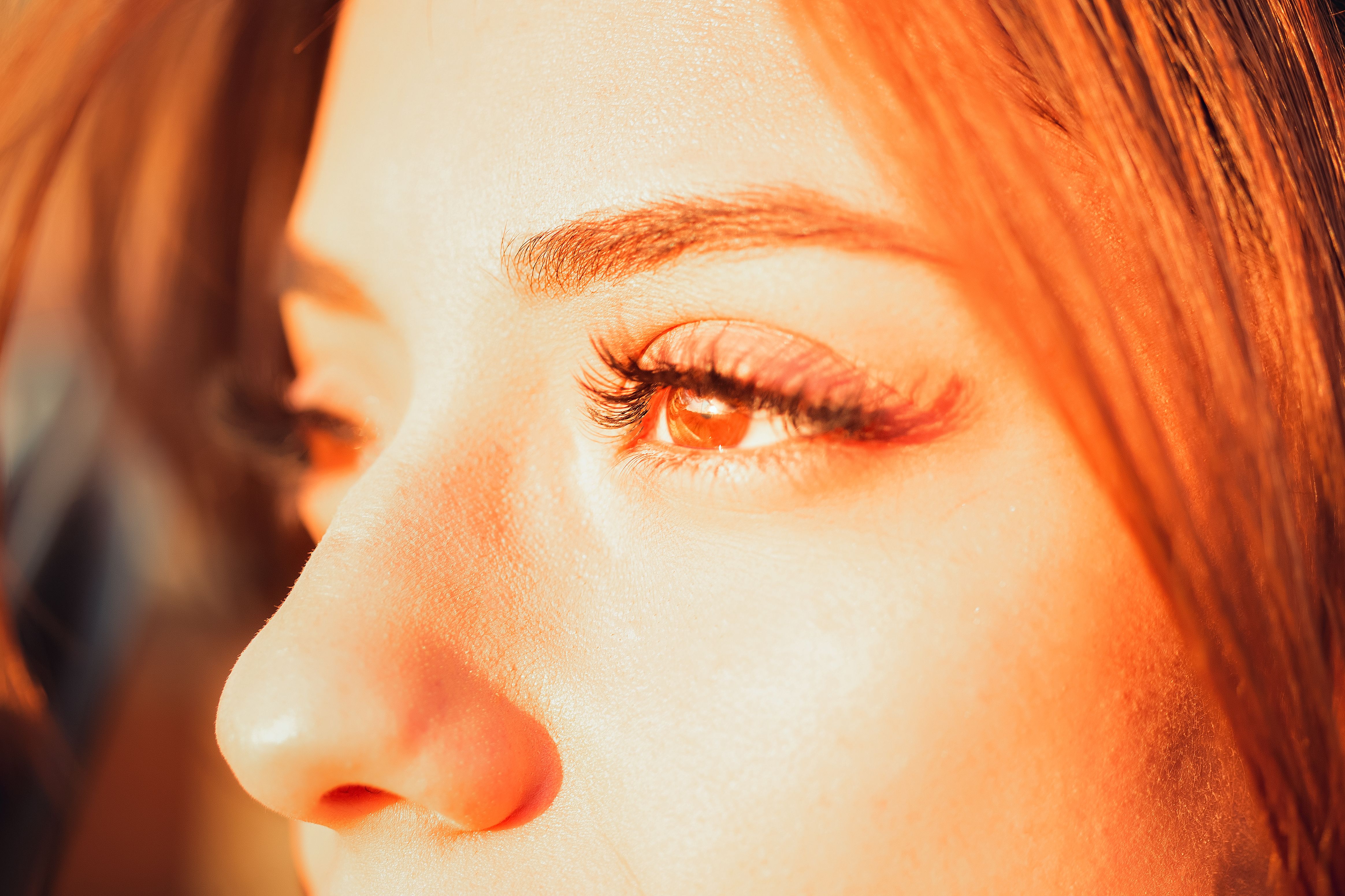 Woman with Prism Light Reflection on her Face · Free Stock Photo