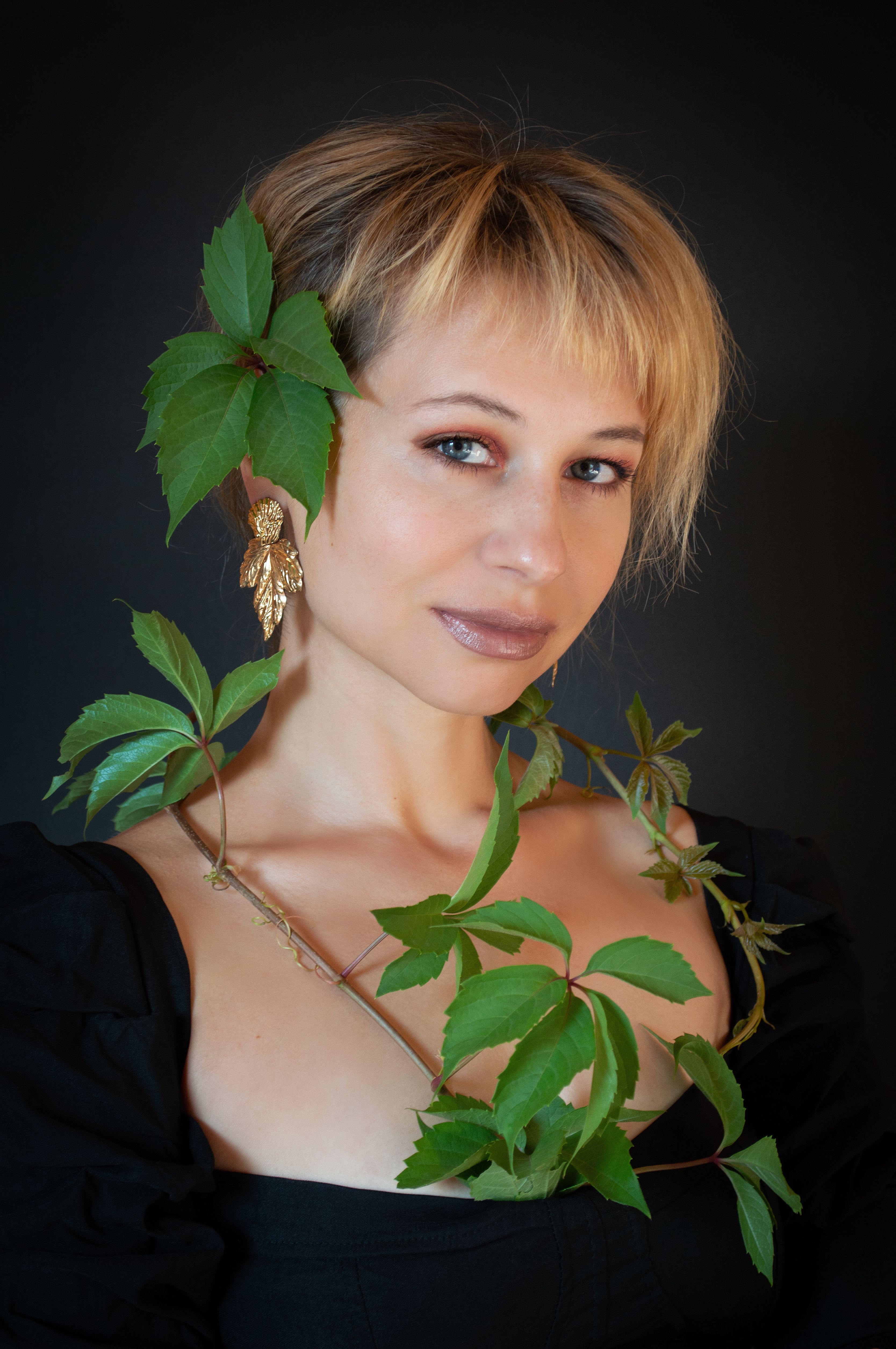 Portrait of a Beautiful Woman with Leaves around her Neck · Free Stock ...