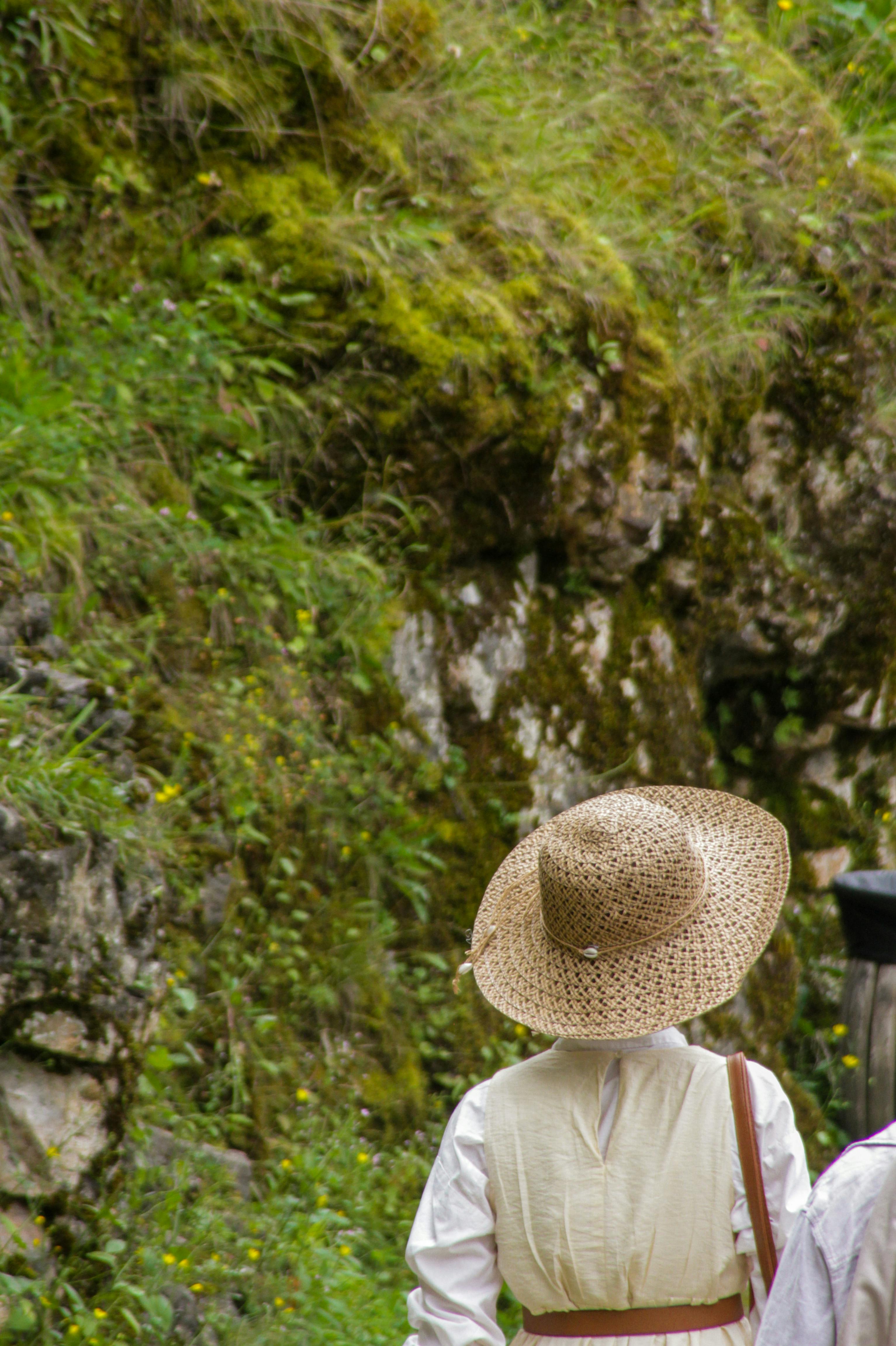Men Wearing Straw Hats Walking on a Path Next to Geysers · Free Stock Photo