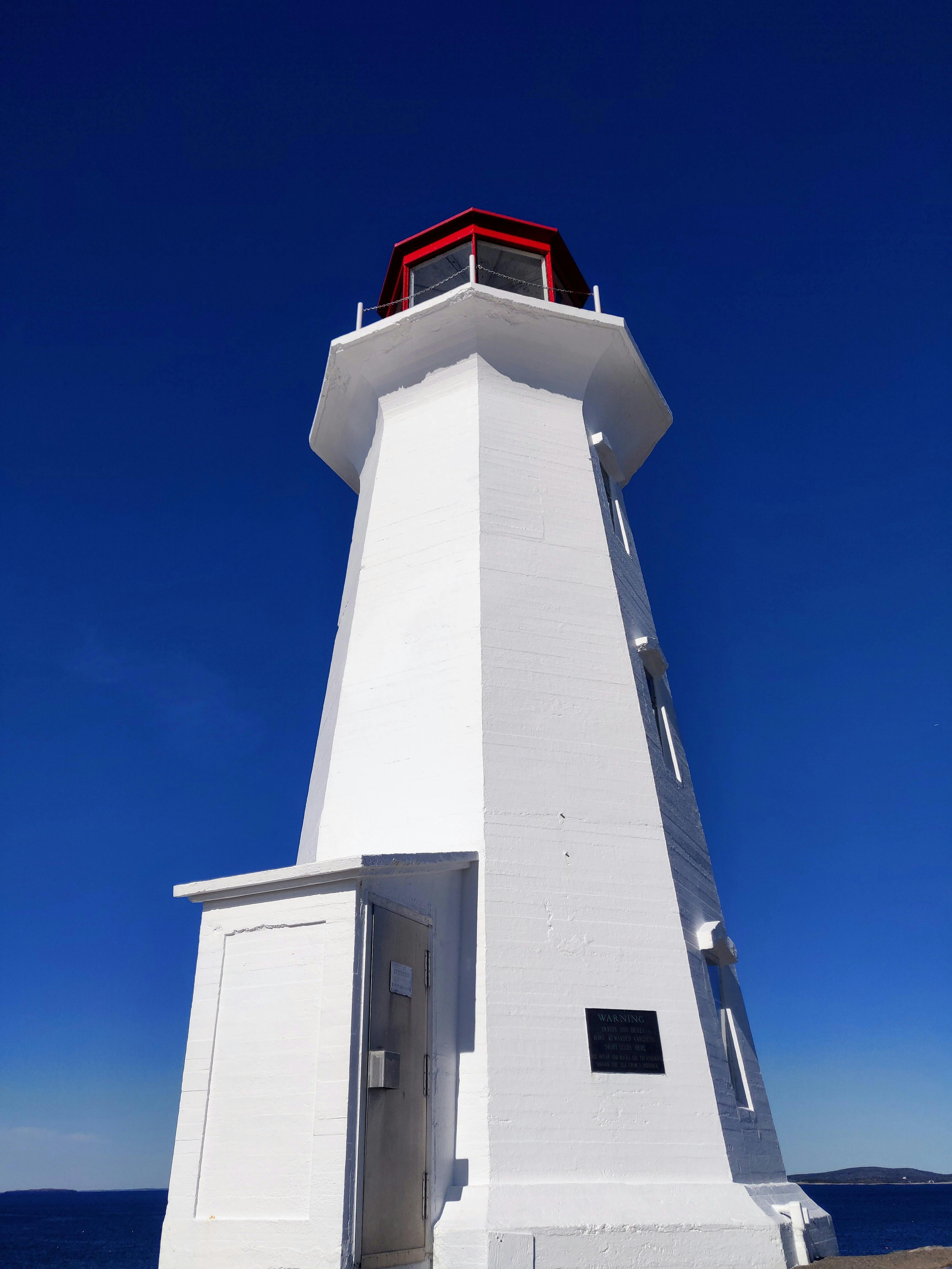 White Lighthouse under Blue Sky · Free Stock Photo