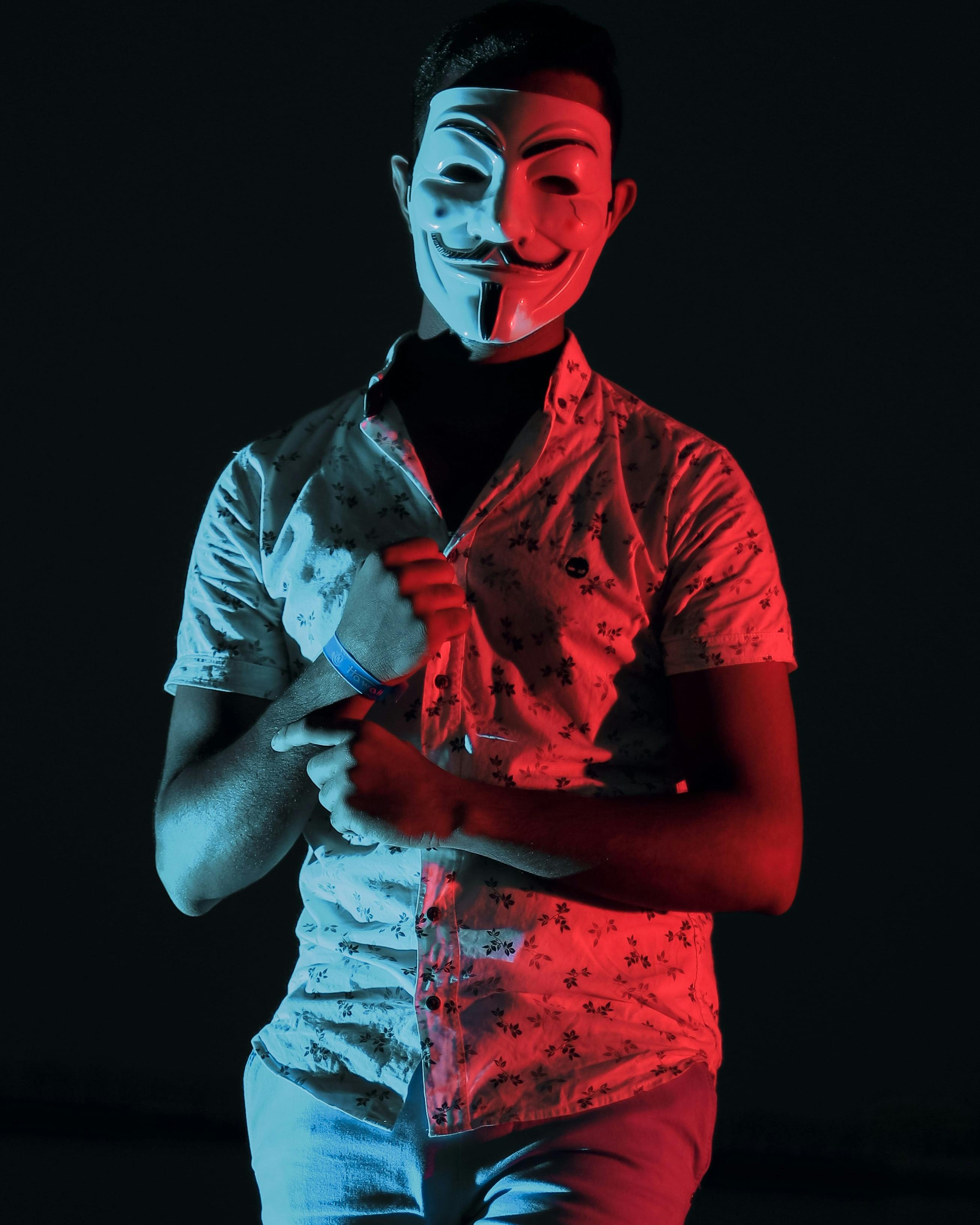 Man covering his Face with a Vendetta Mask · Free Stock Photo