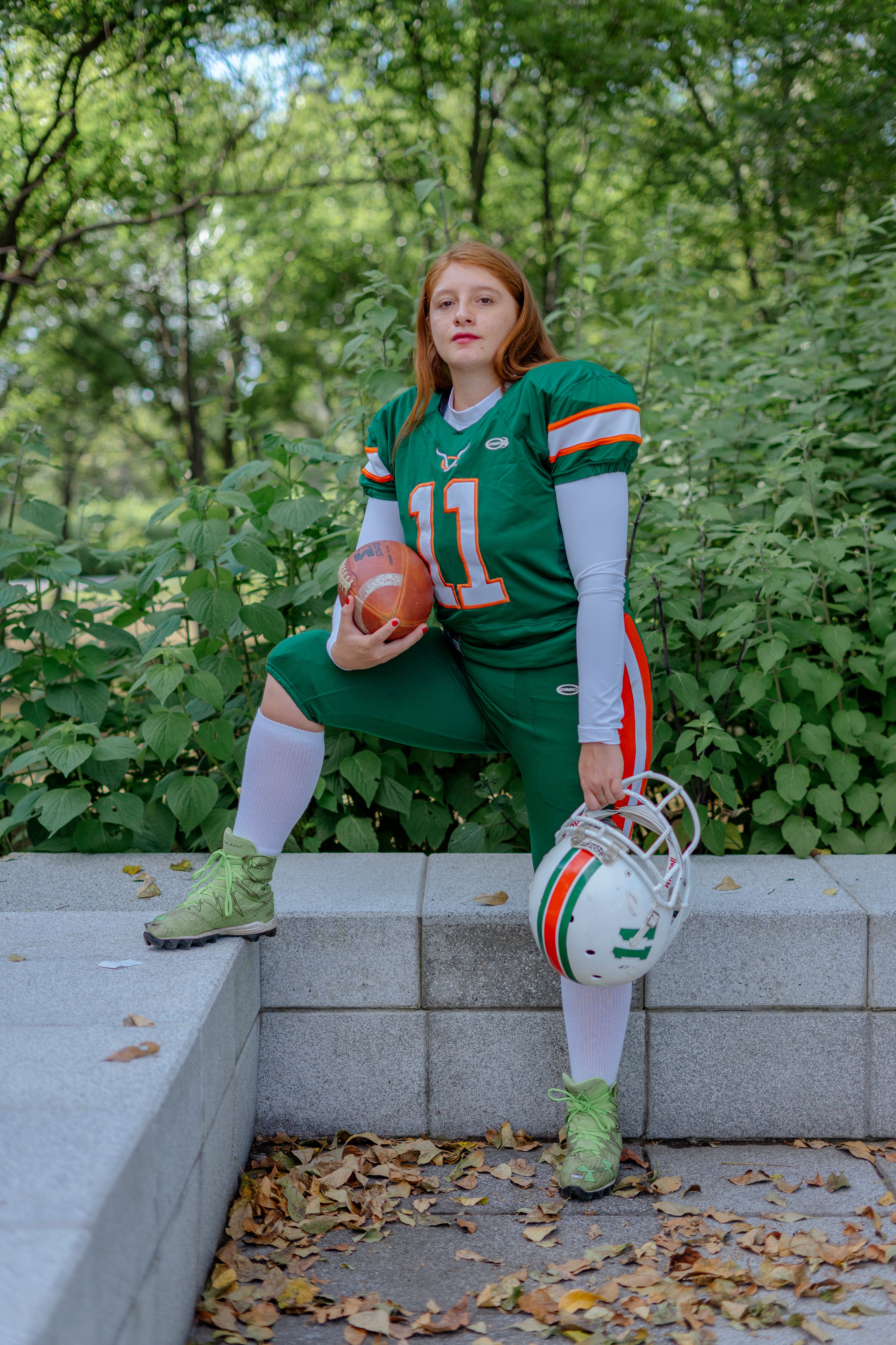 Girl Wearing American Football Clothing and Holding the Ball · Free ...