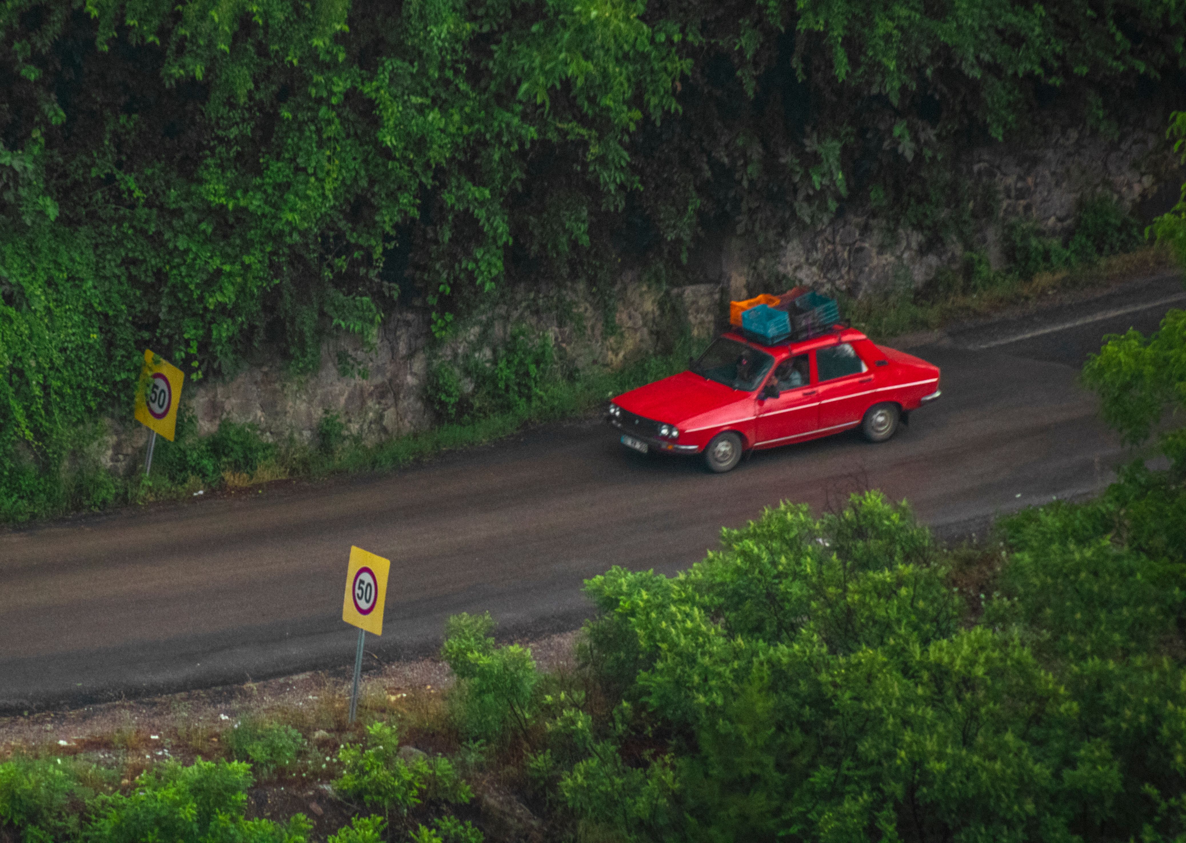 Red Vintage Car Stopped on the Crossroads · Free Stock Photo