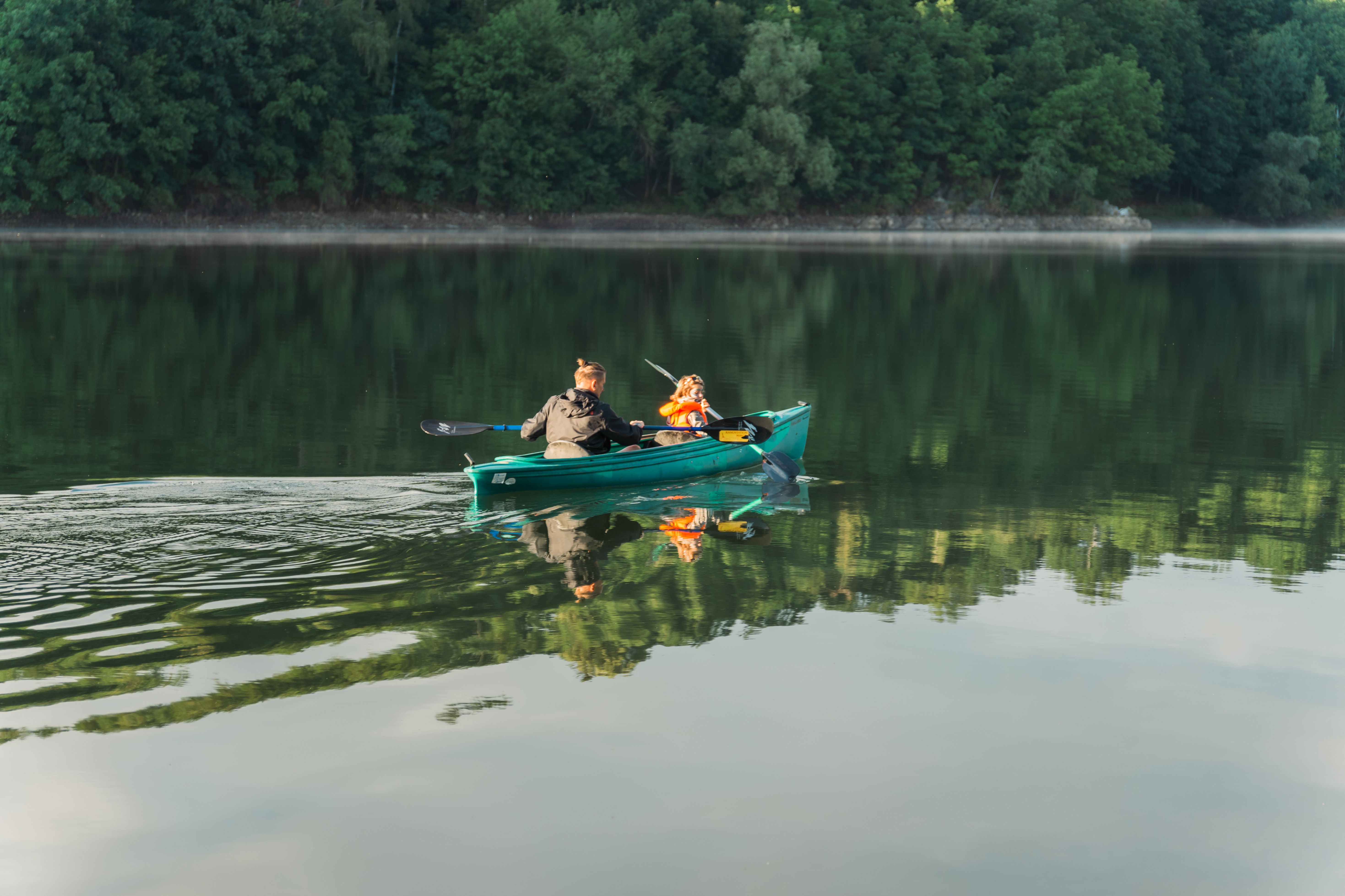People Swimming on a Boat on Lake · Free Stock Photo