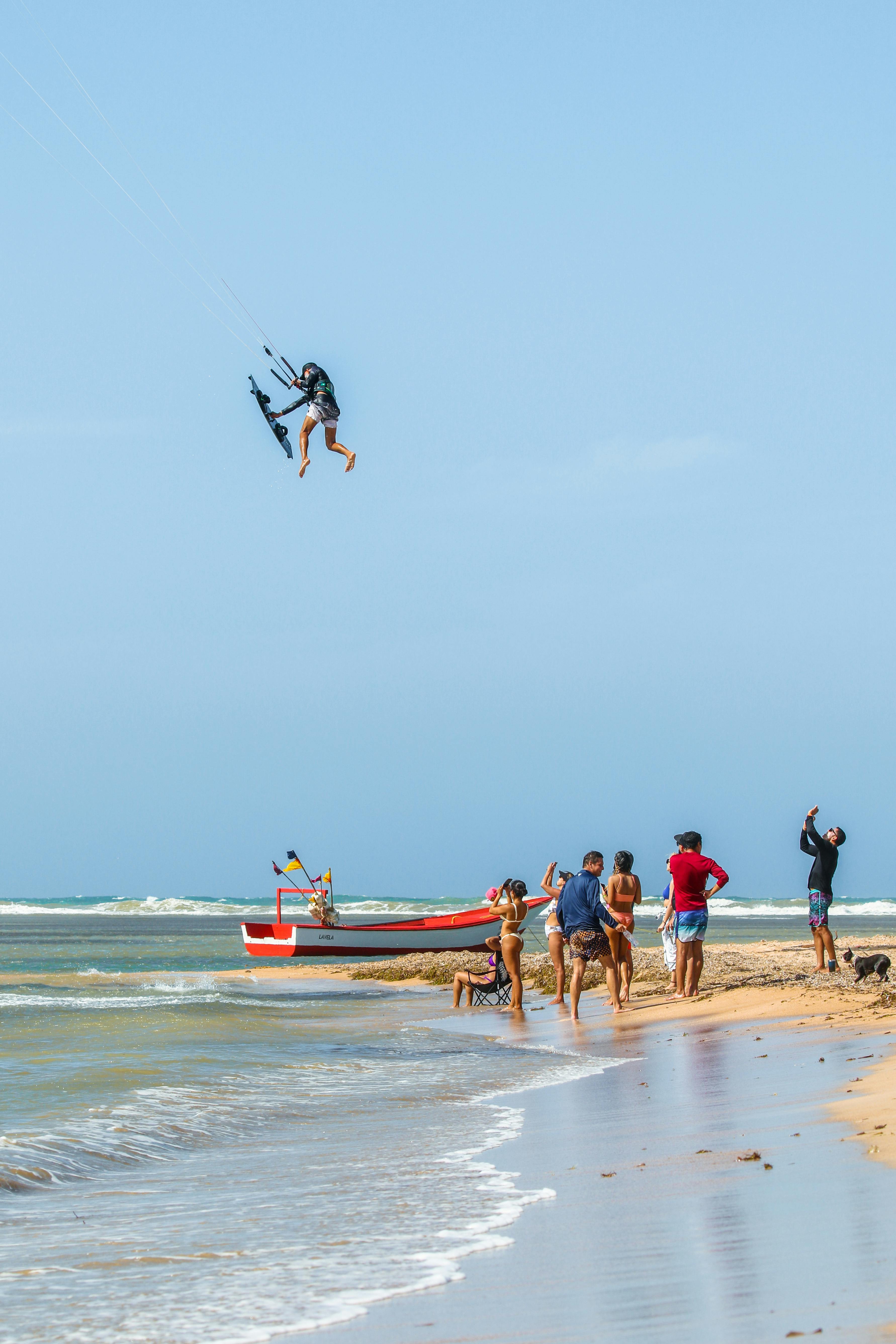 A Person Diving into the Water from a Little Boat · Free Stock Photo