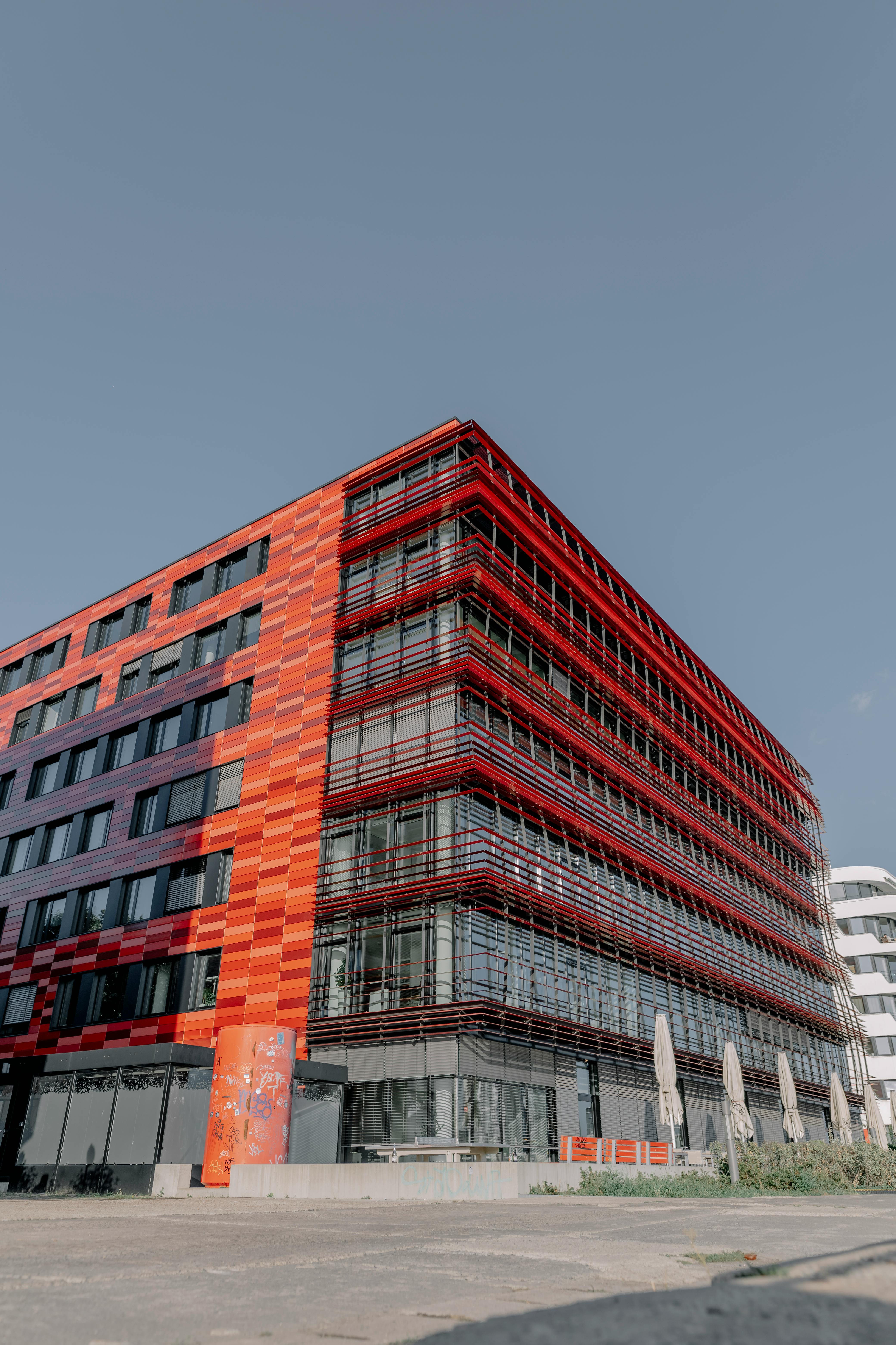 Red Concrete Building Under the Blue Sky · Free Stock Photo