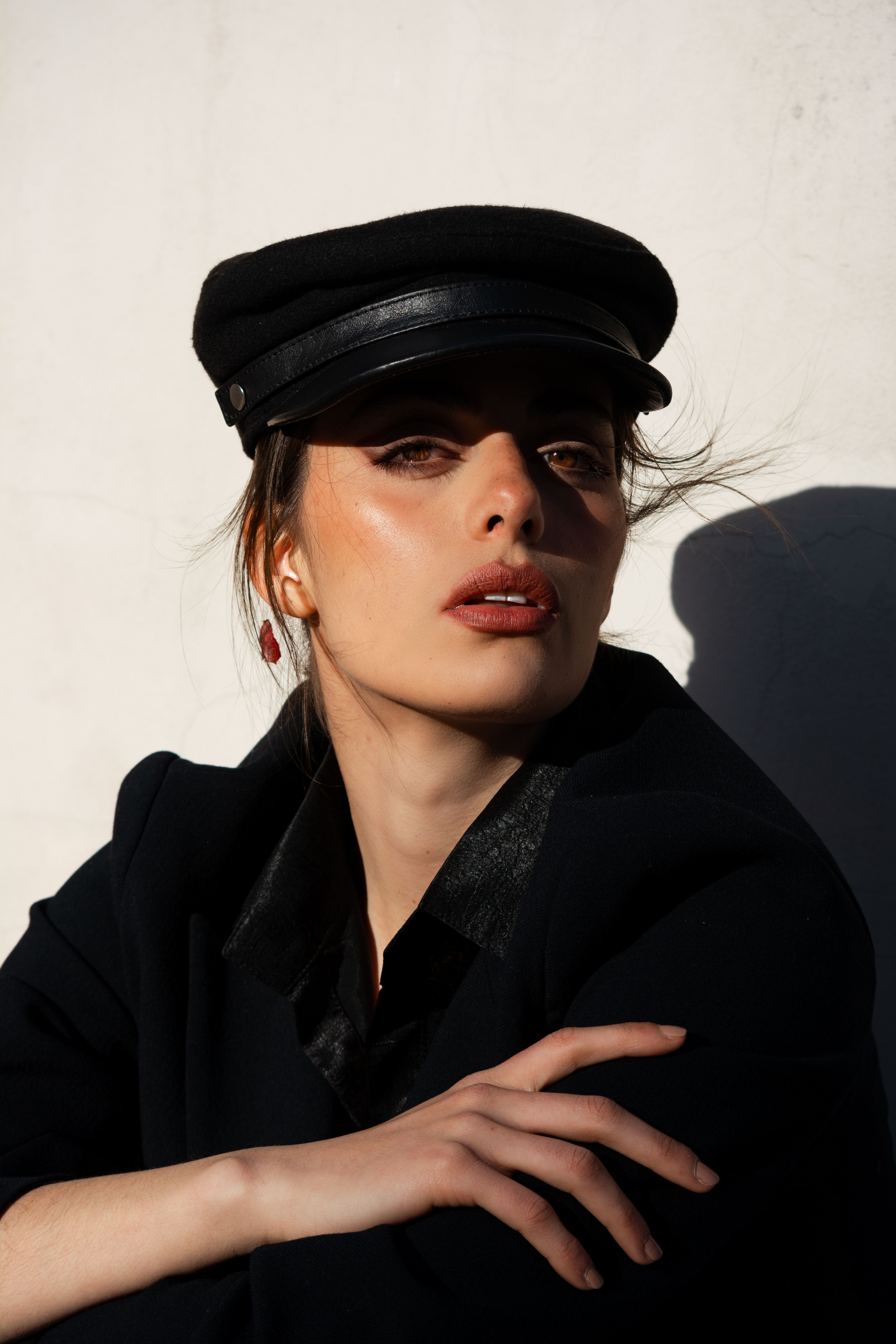 Portrait of a Woman with a Black Cap · Free Stock Photo