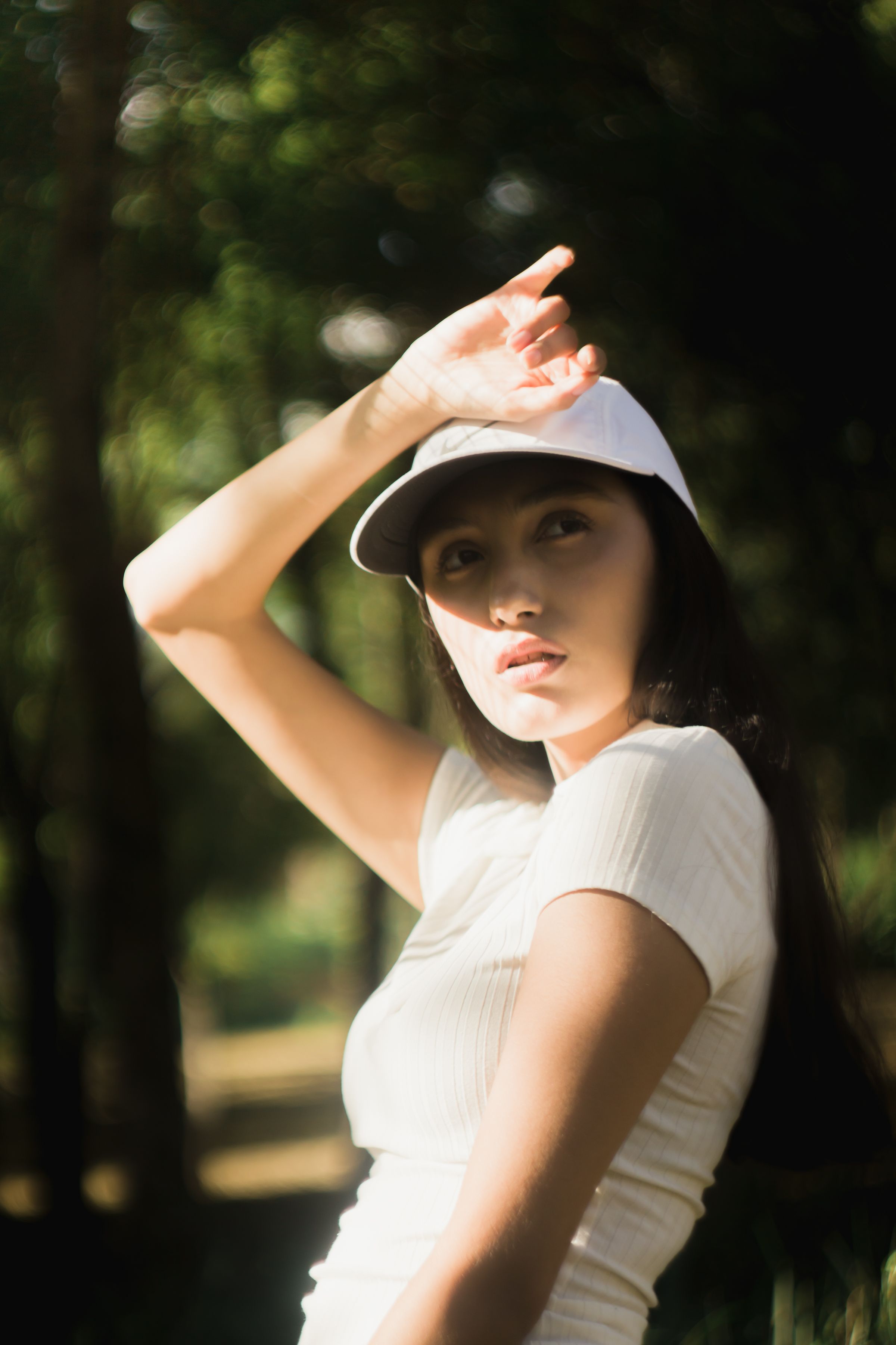 Young Woman with Hand Raised · Free Stock Photo