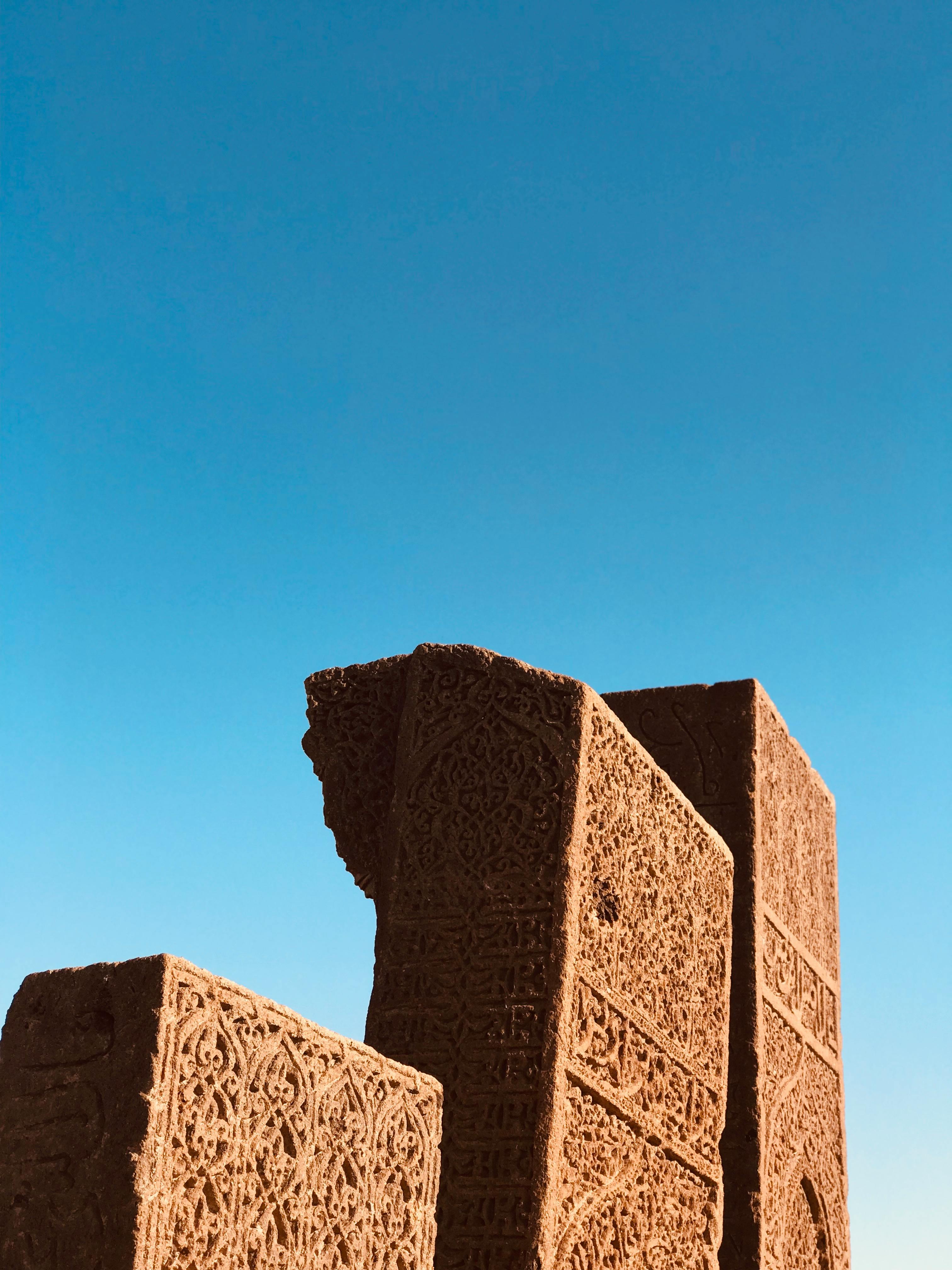 Ahlat Stonework Pillars against Blue Sky · Free Stock Photo