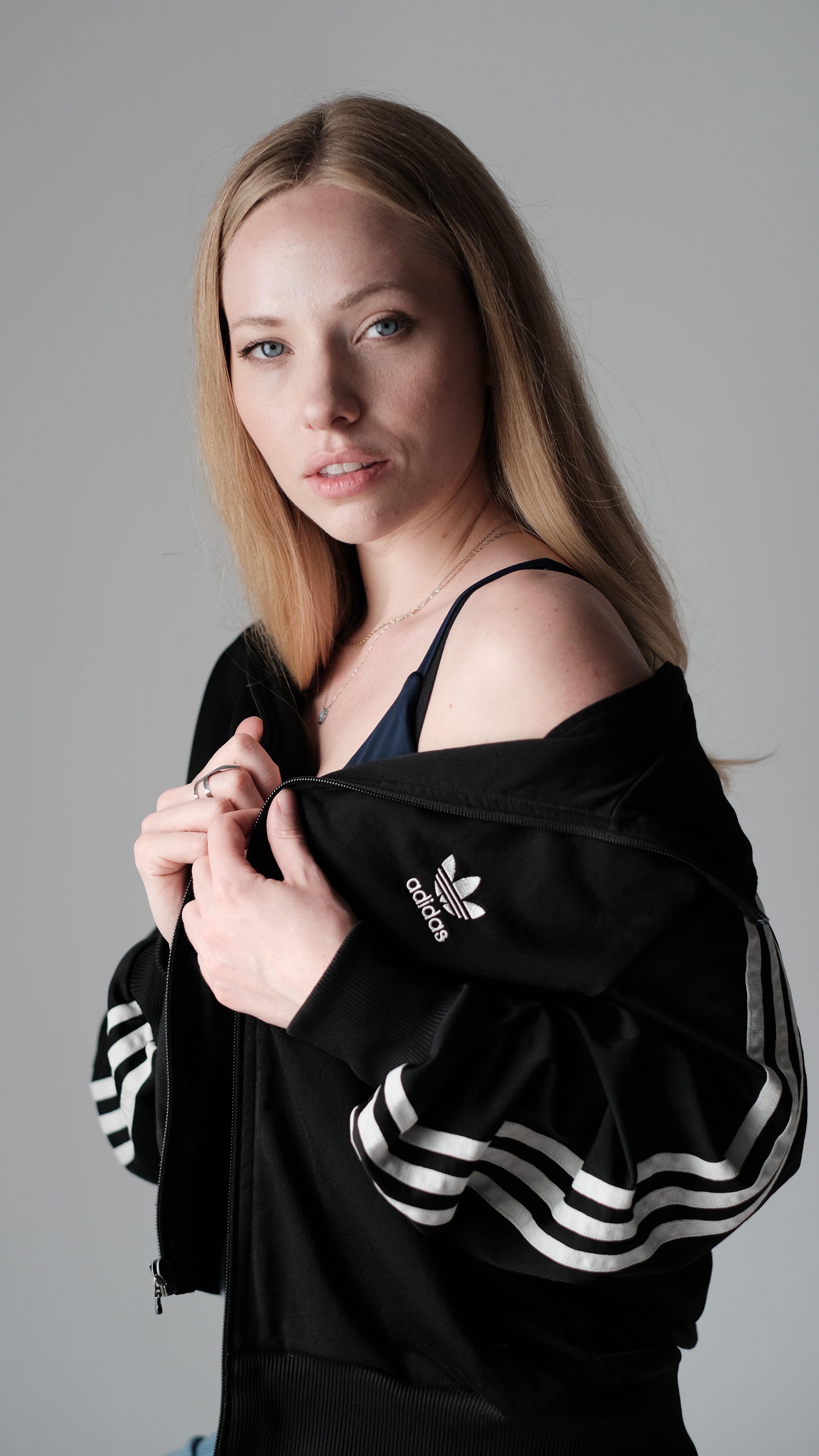 A Woman Unzipping Her Jacket · Free Stock Photo