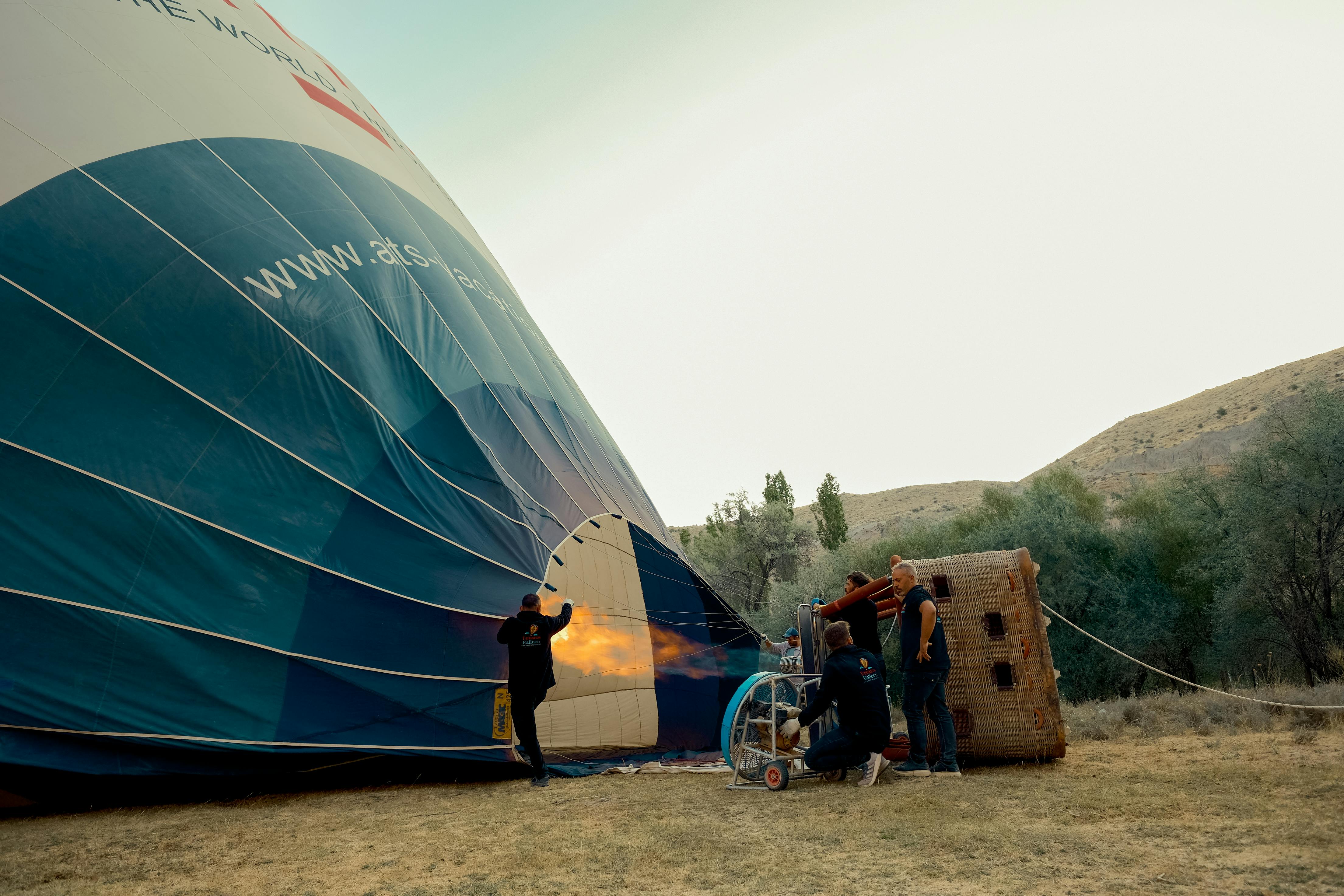 Men by Lying Hot Air Balloon · Free Stock Photo